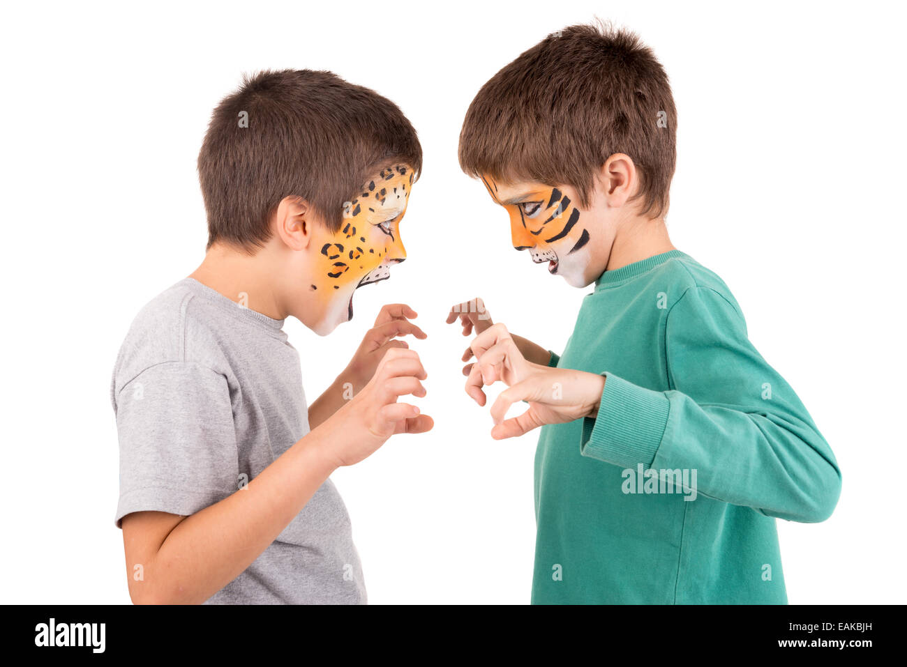 Boys with face-painted like a leopard and tiger isolated in white Stock ...