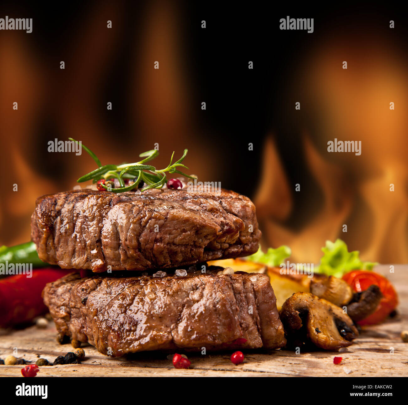Delicious beef steakes on wood Stock Photo - Alamy