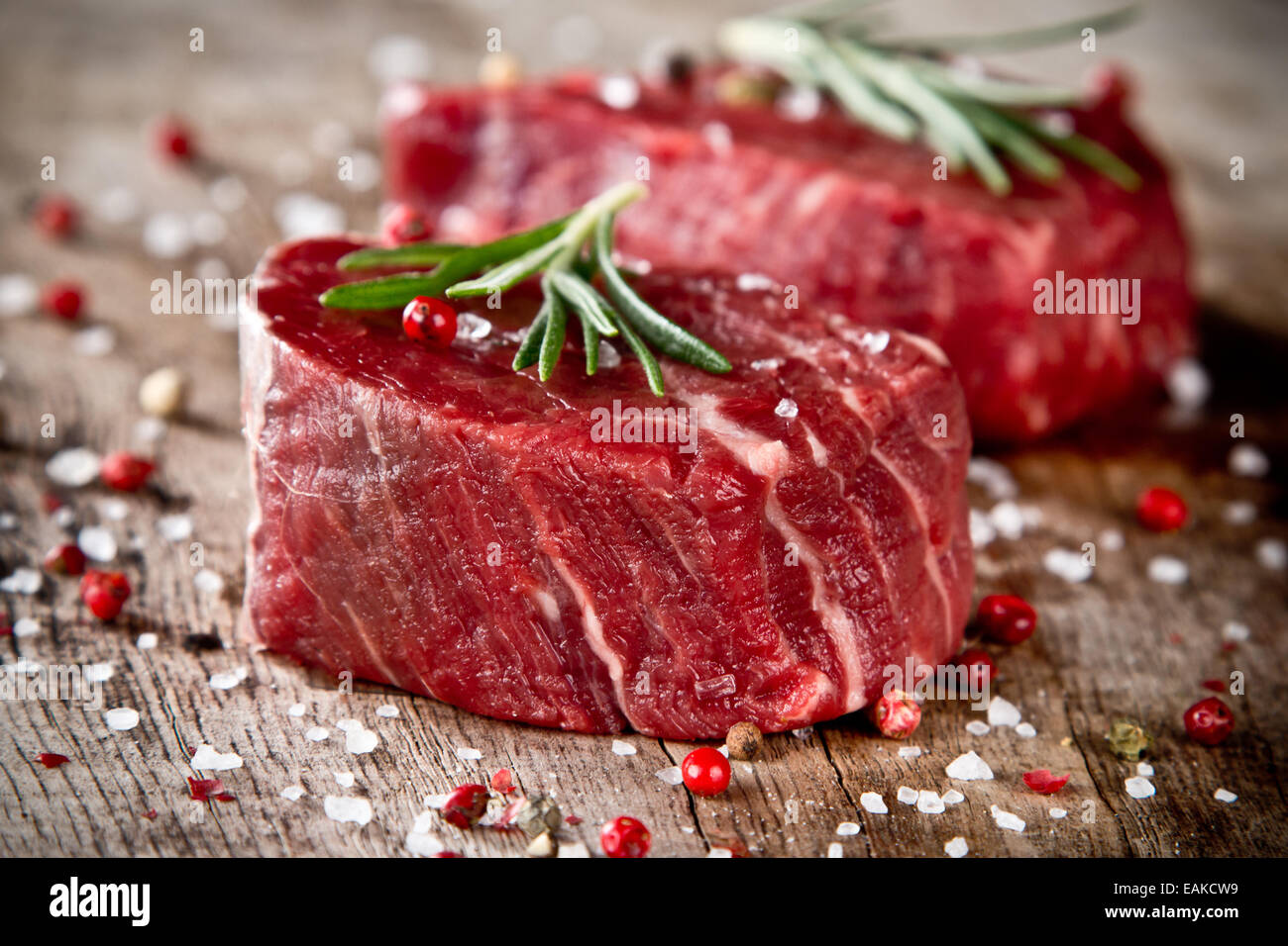 Fresh raw beef steak on wood Stock Photo - Alamy