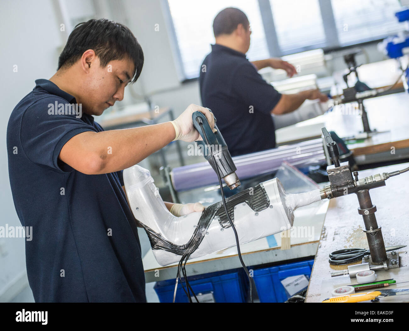 Employees of Ottobock, manufacturer of orthopaedic technology, works on ...