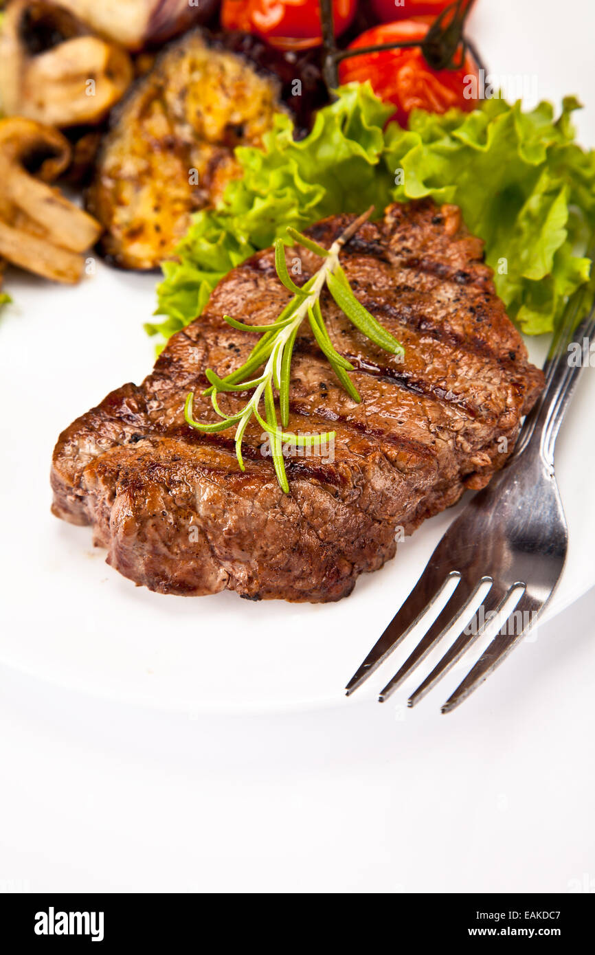 Delicious beef steak isolated on white background Stock Photo - Alamy