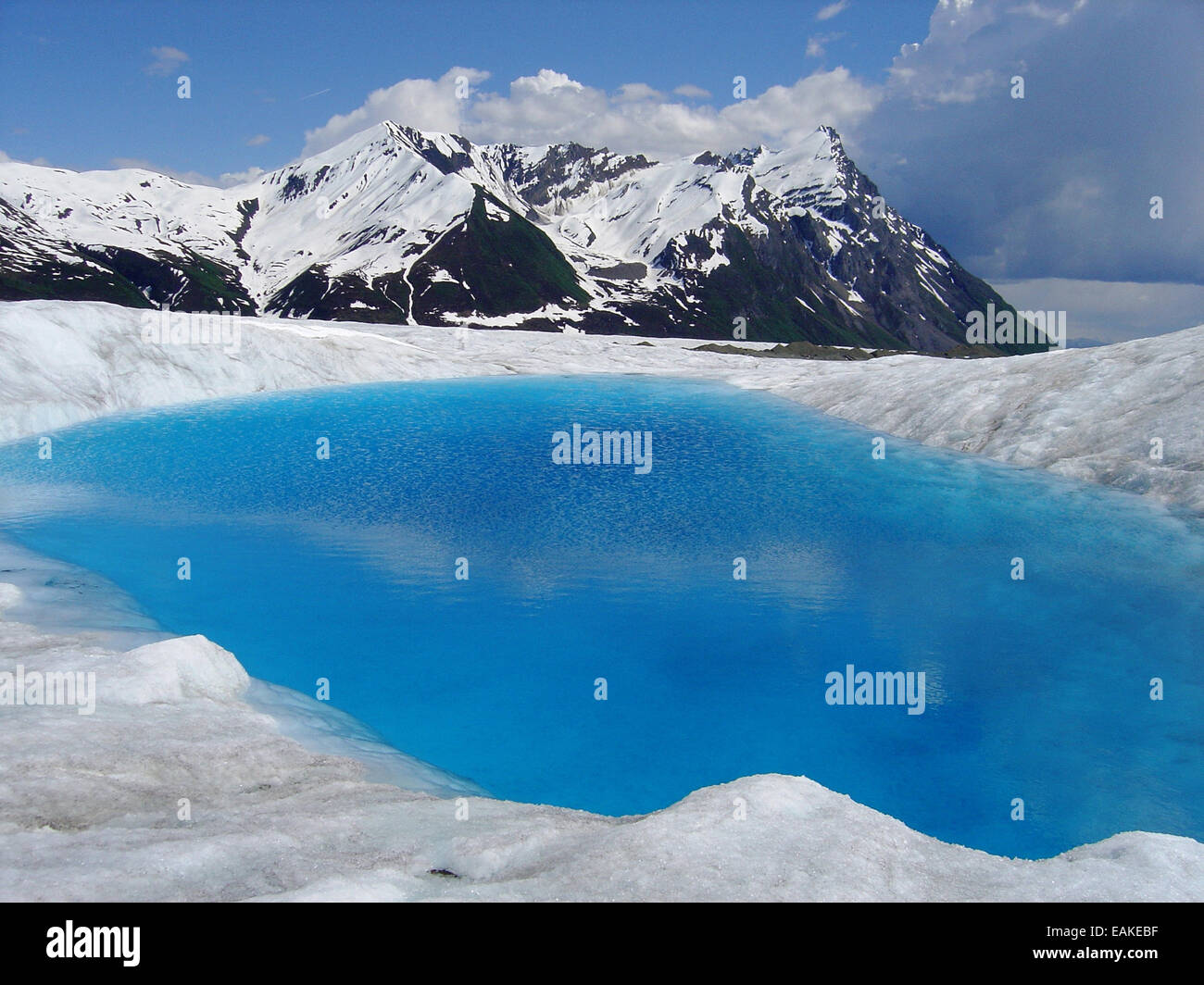 A deep blue glacial pool at Wrangell St. Elias National Park in Alaska ...