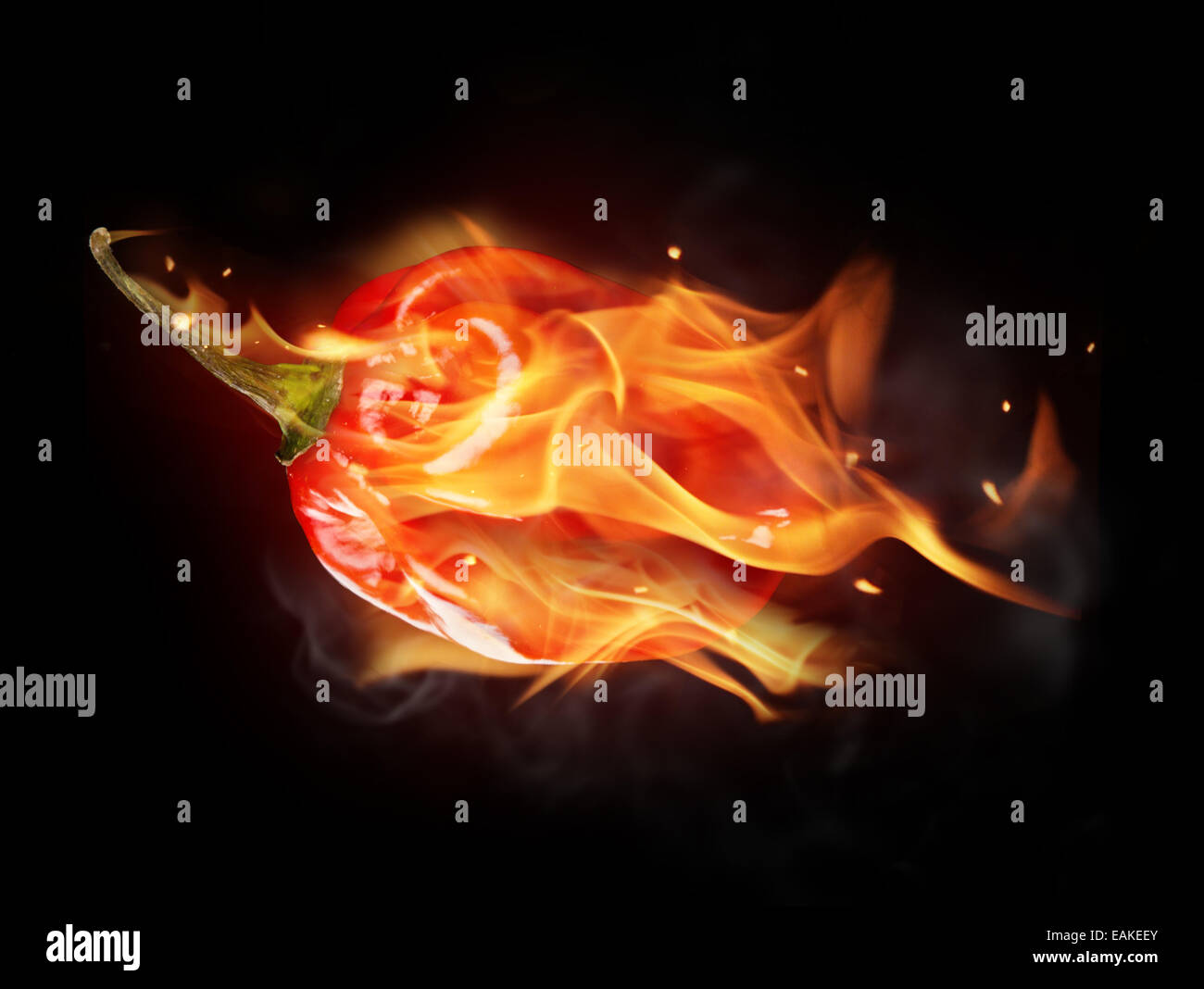 Burning red chilli pepper isolated on black background Stock Photo - Alamy