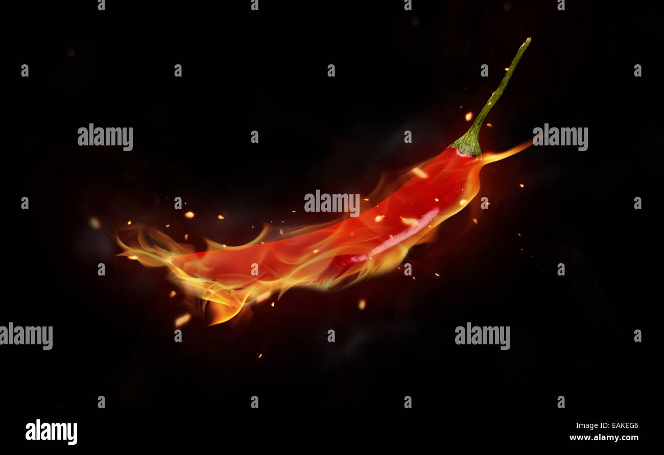 Burning red chilli pepper isolated on black background Stock Photo - Alamy