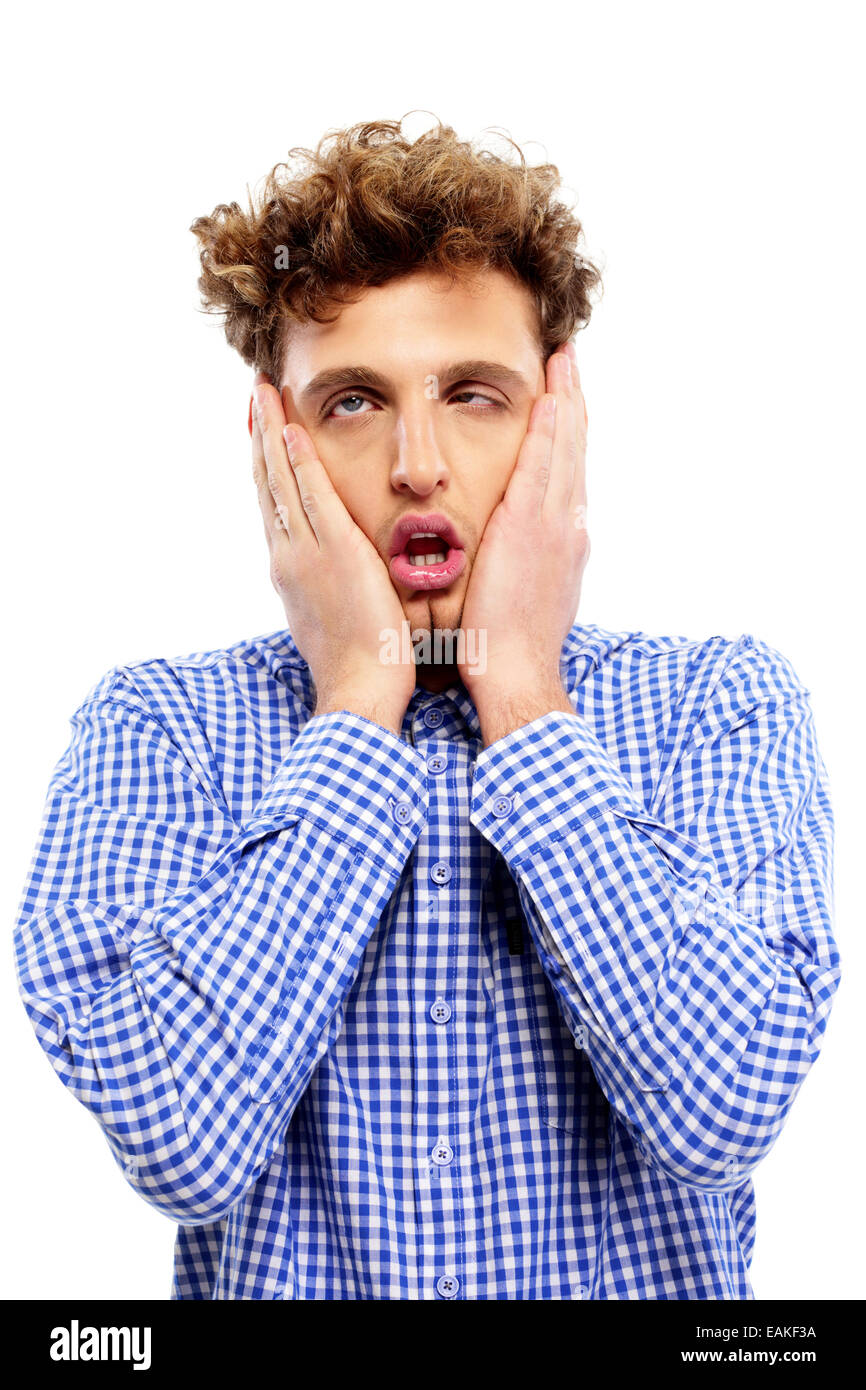 Portrait of a tired casual man over white background Stock Photo - Alamy