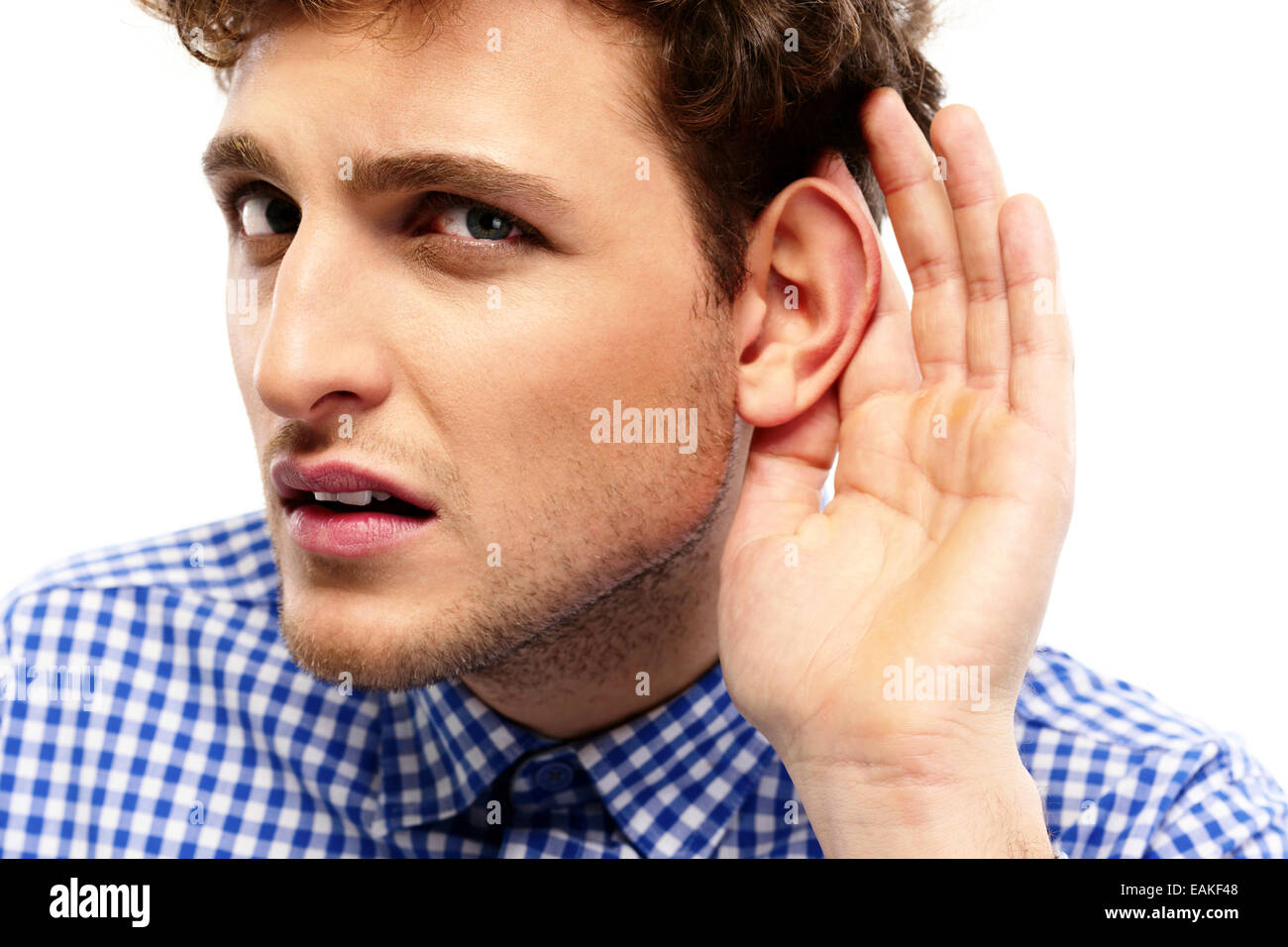 Portrait of young casual man which overhears conversation Stock Photo ...