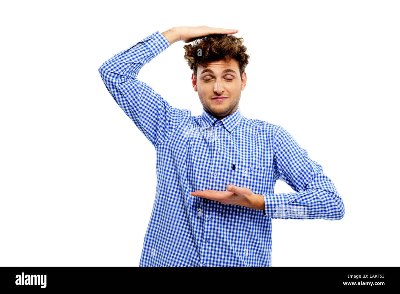 Funny young man gesturing with his hands on white background Stock ...