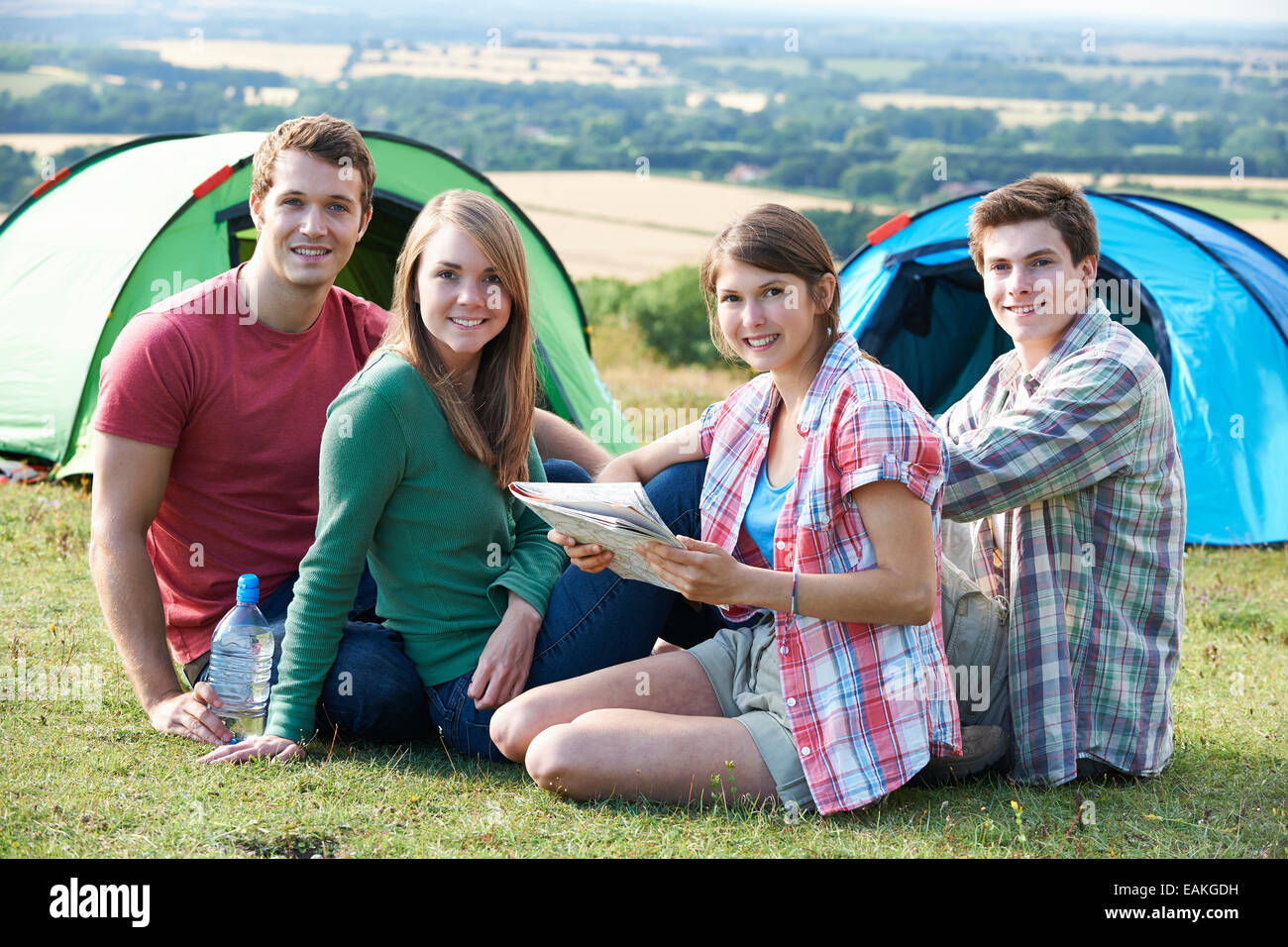 Group Of Young Friends Camping In Countryside Stock Photo - Alamy
