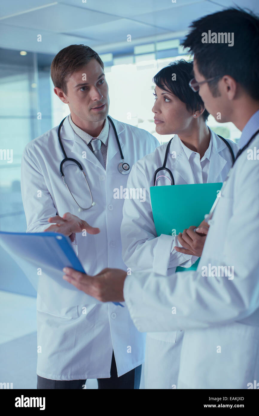 Doctors discussing patient's treatment Stock Photo - Alamy