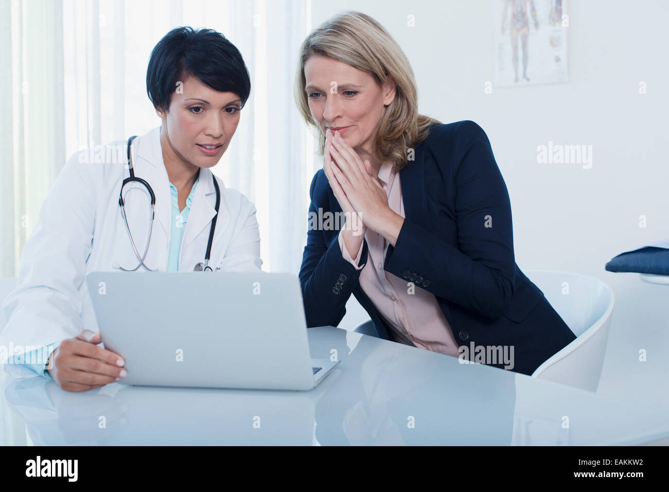 Female doctor using laptop sitting hi-res stock photography and images ...