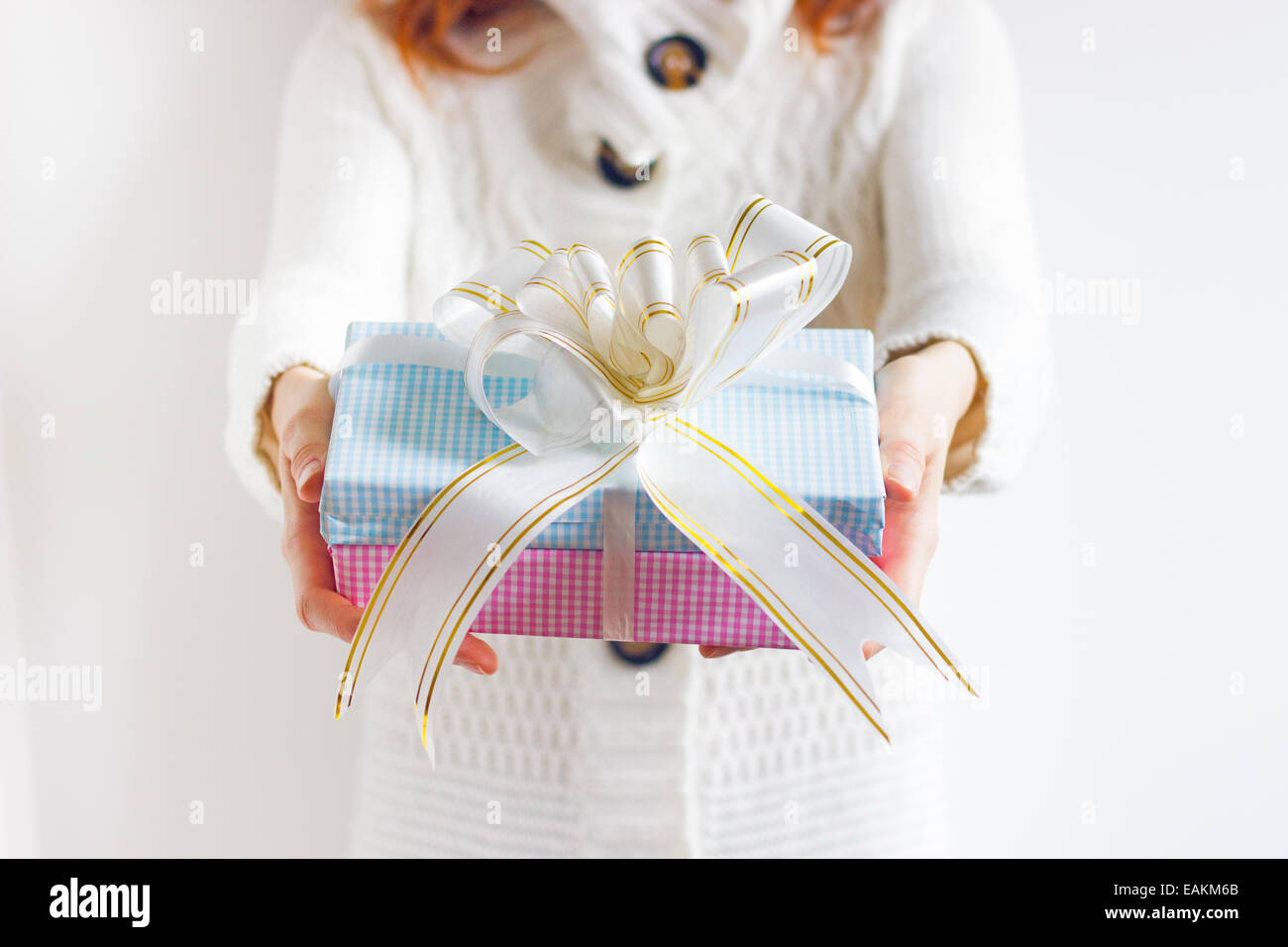 Girl offering gifts, closeup Stock Photo - Alamy