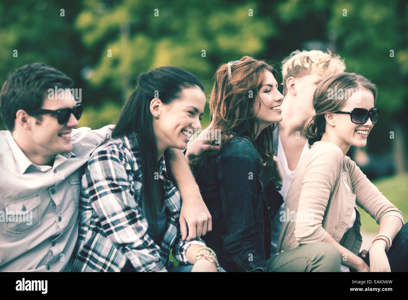 group of students or teenagers hanging out Stock Photo - Alamy