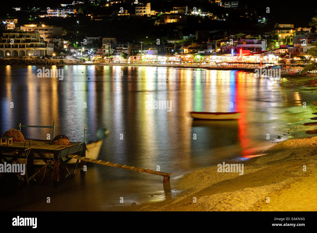 The beach, tavernas and bars in night illumination, Crete island ...