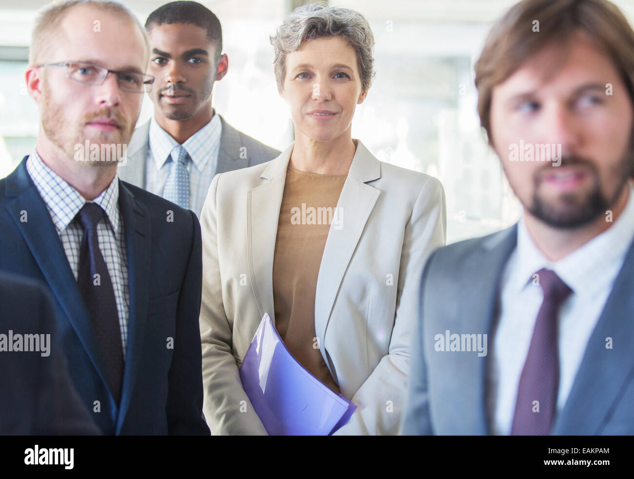 Group portrait of successful office team standing in office Stock Photo ...