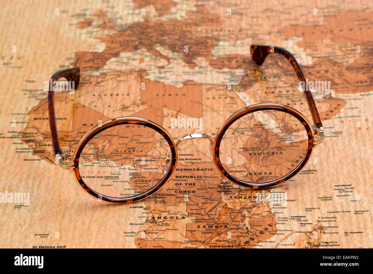 Glasses on a map of a world - Africa Stock Photo - Alamy
