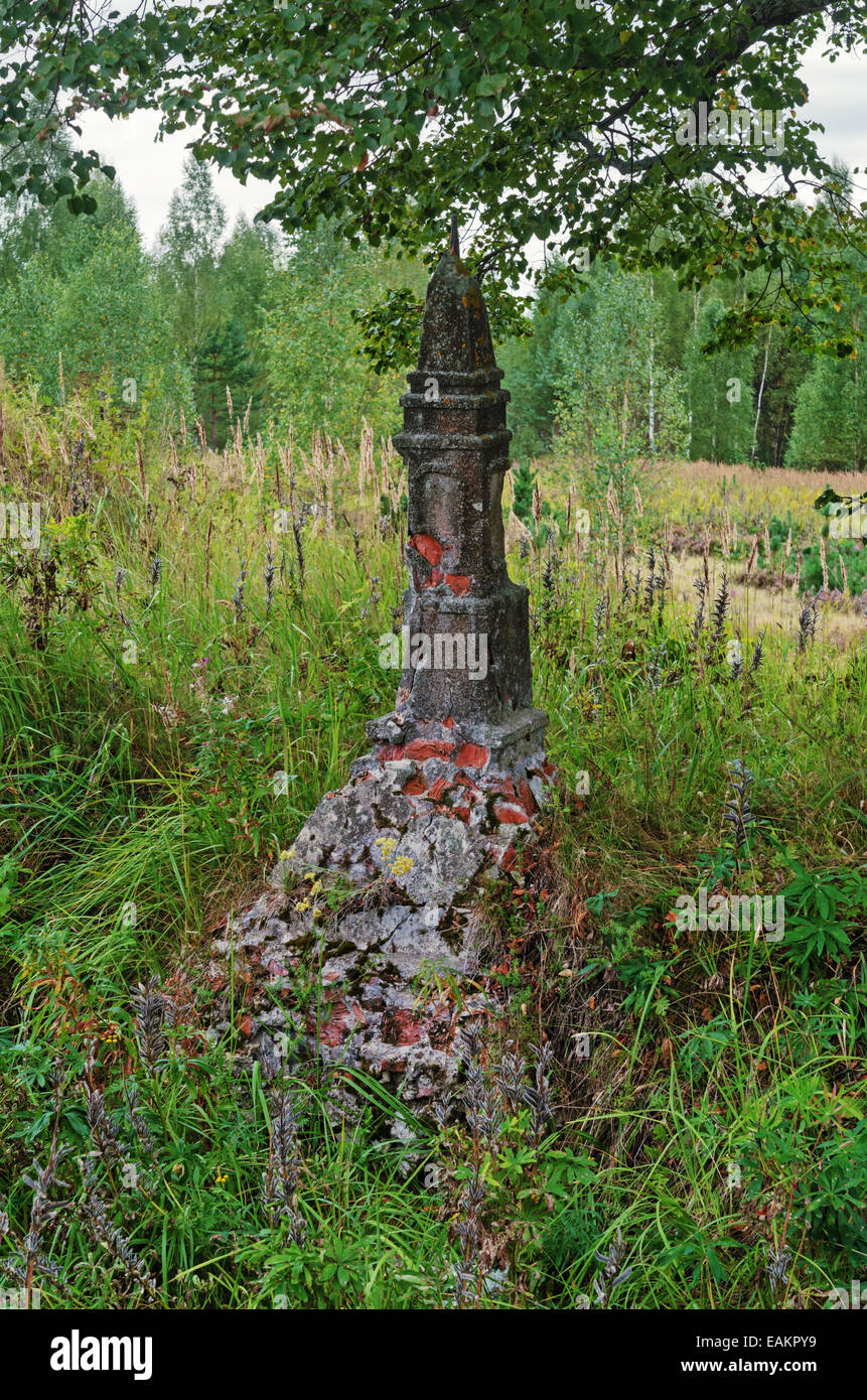 Forest landscape. Old monument for designation of the highest place ...