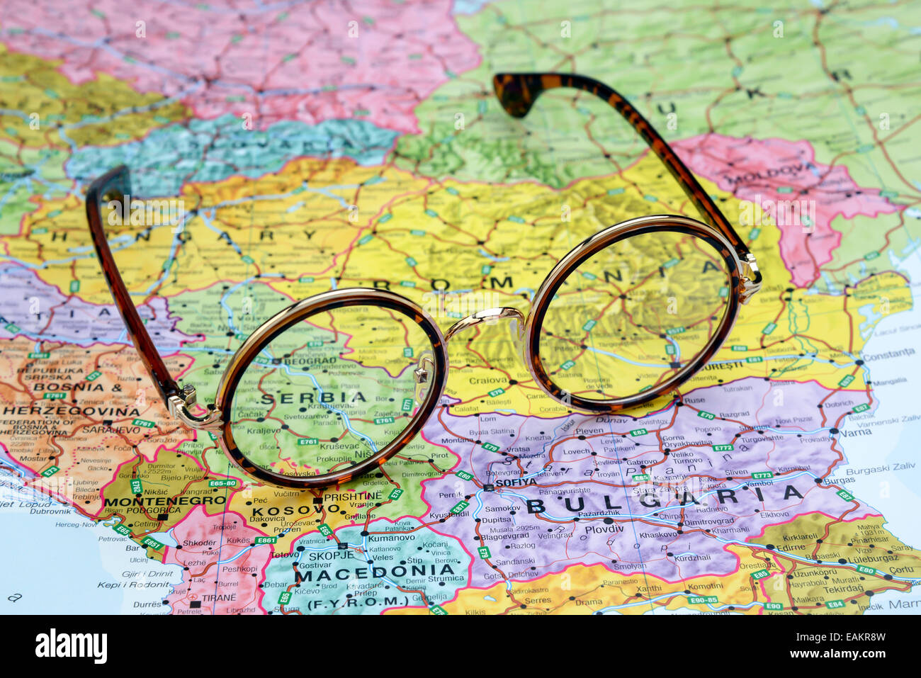 Glasses on a map of europe - Serbia Stock Photo - Alamy