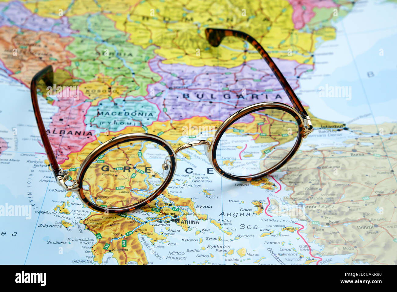 Glasses on a map of europe - Greece Stock Photo - Alamy