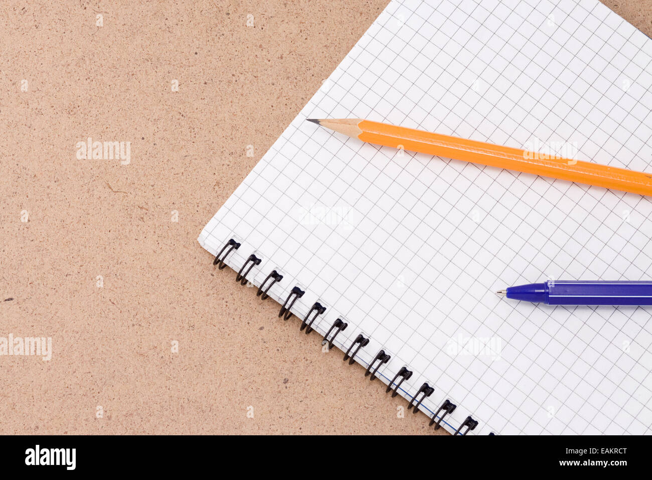 pen and pencil on checked pad Stock Photo - Alamy