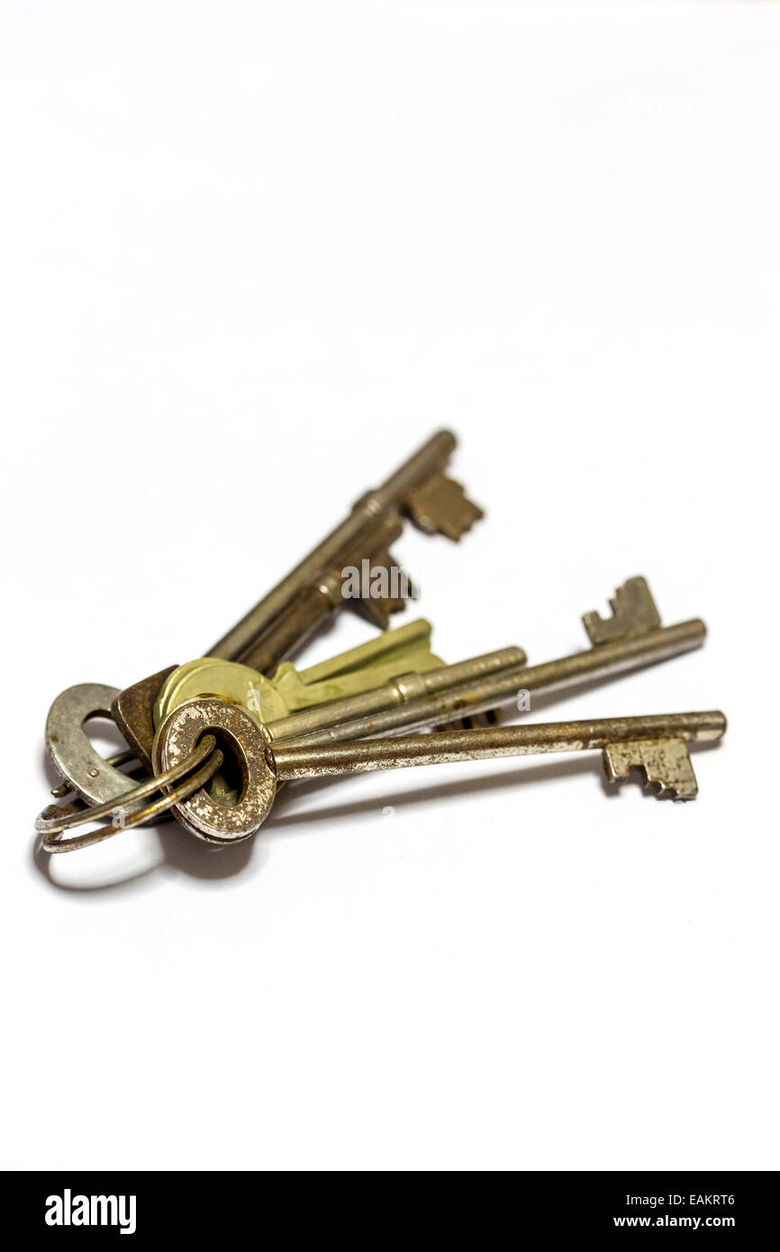 Old keys on keyring on a plain white background Stock Photo - Alamy