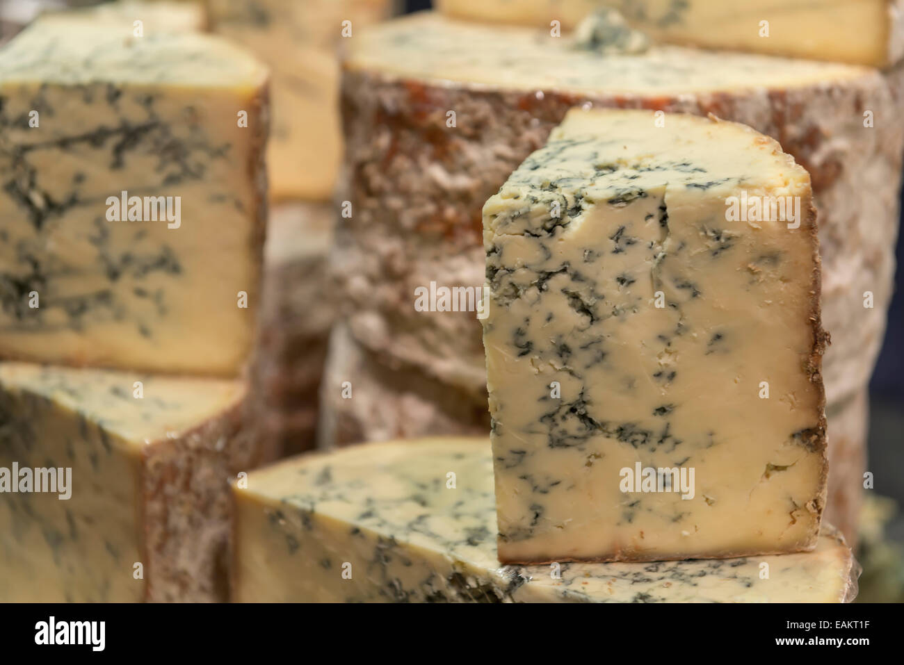Stack of different sized portions of blue cheese on display Stock Photo ...
