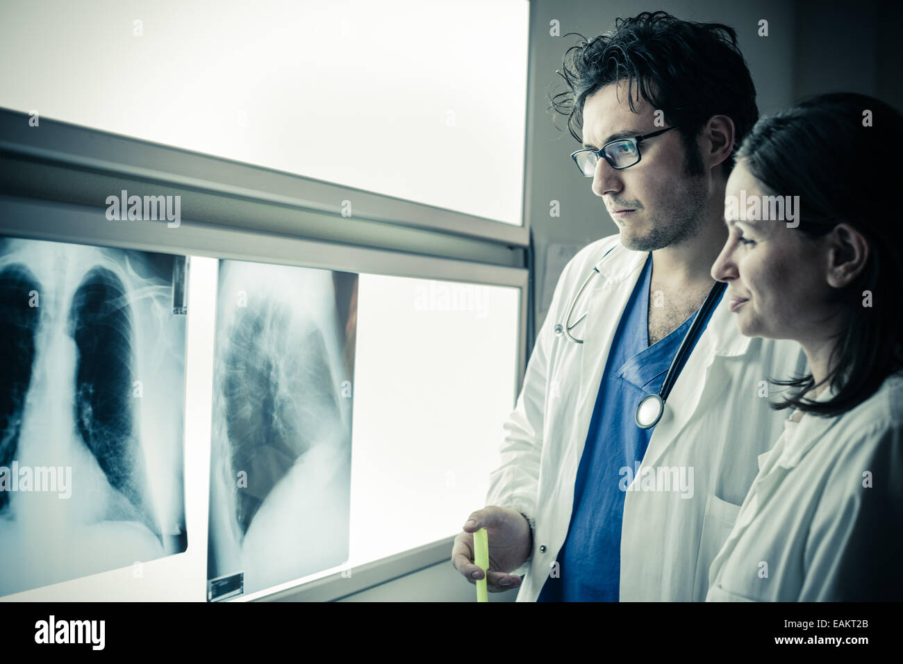 Two doctors examining x ray image hi-res stock photography and images ...