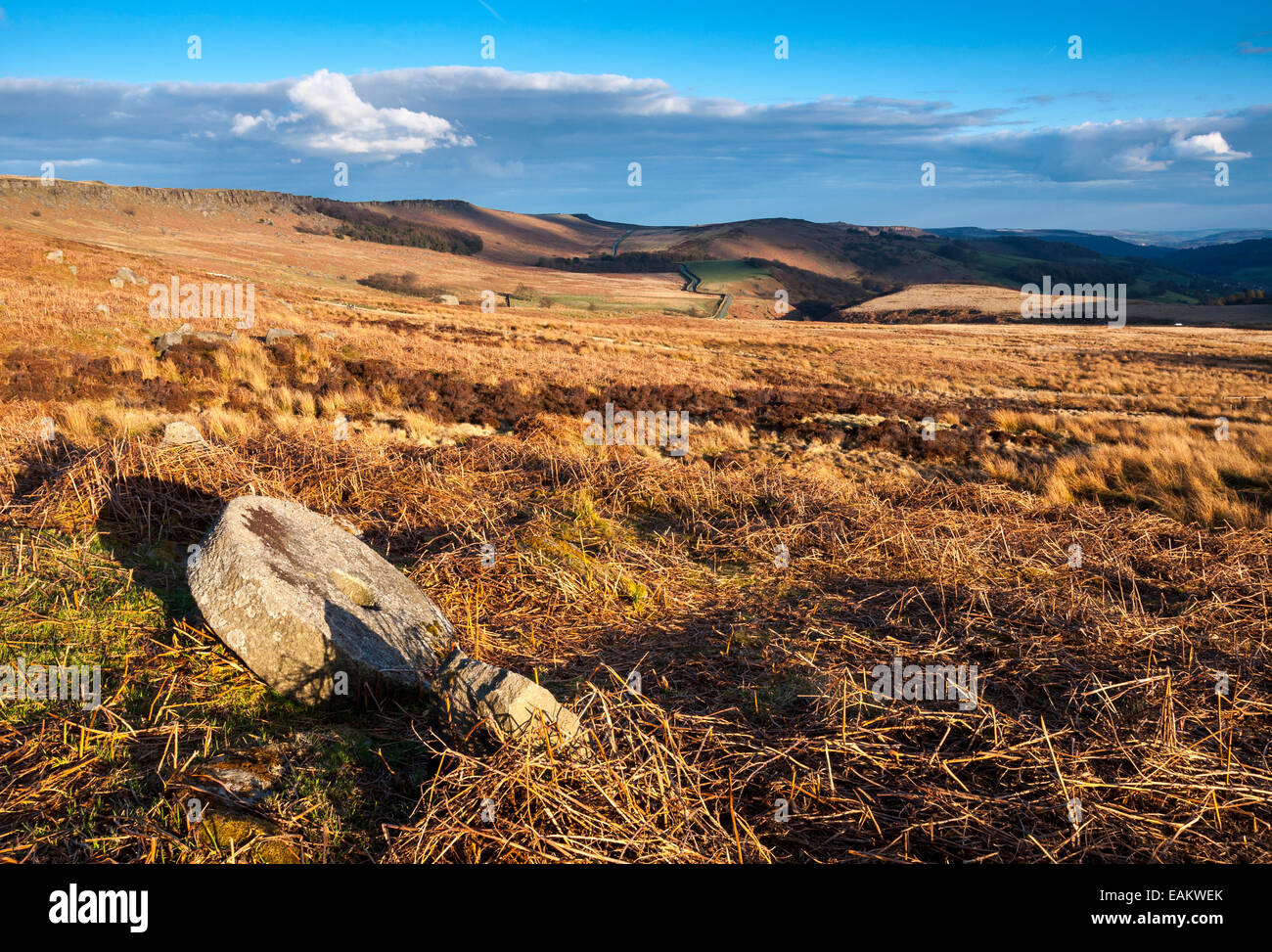 Millstone in a colourful moorland landscape at sunset. Stanage Edge in ...