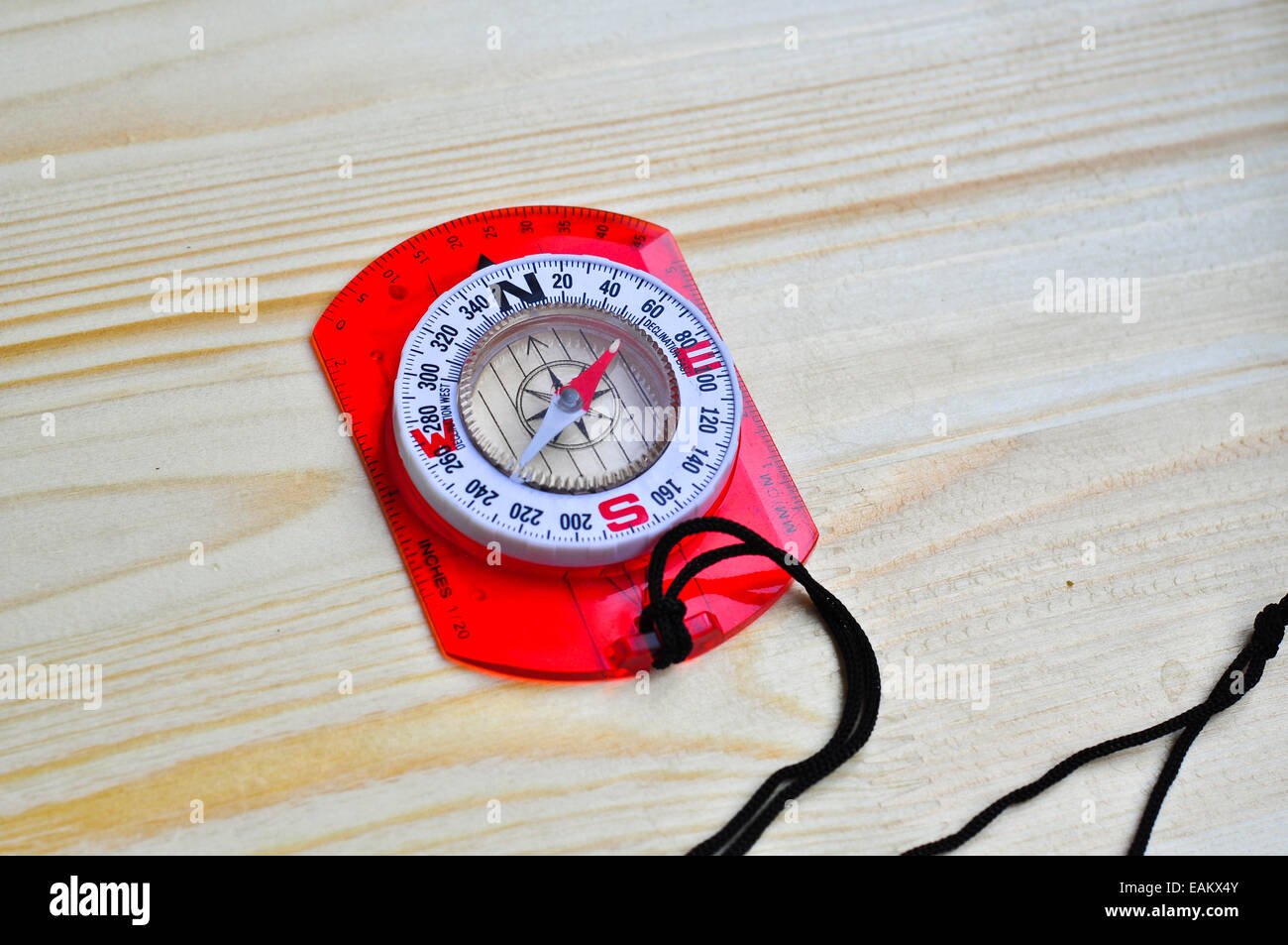 The compass on the Board. The magnetic compass lies on textured wood ...