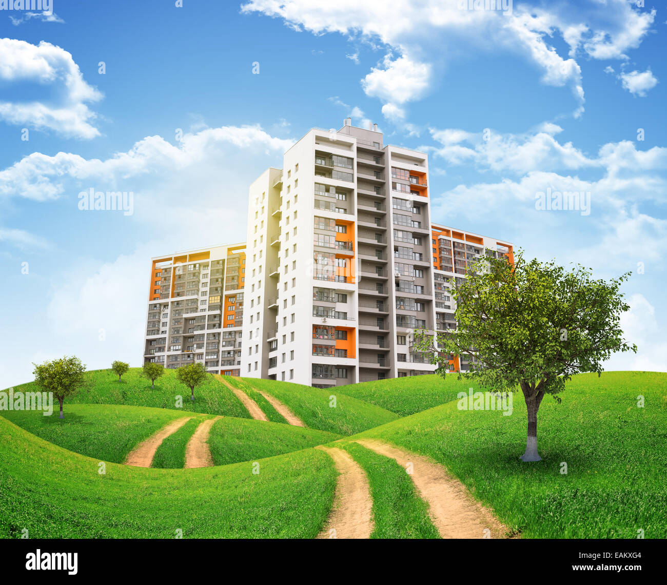 Tall buildings, green hills and road against sky with clouds Stock ...