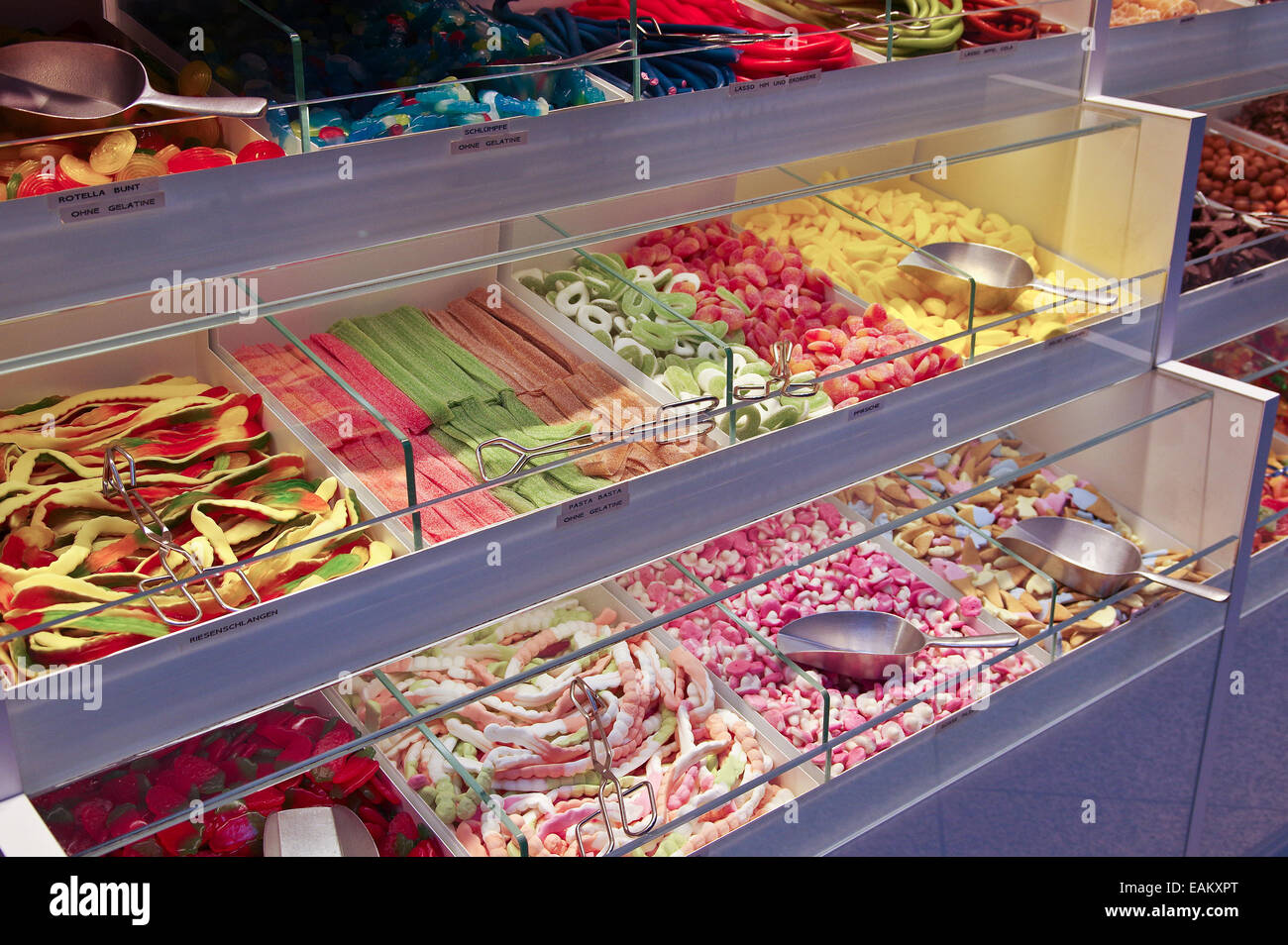 Sweets in different colors displayed in a window Stock Photo - Alamy