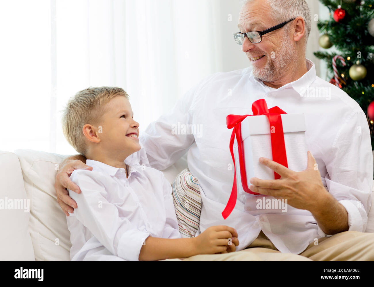 smiling grandfather and grandson at home Stock Photo - Alamy