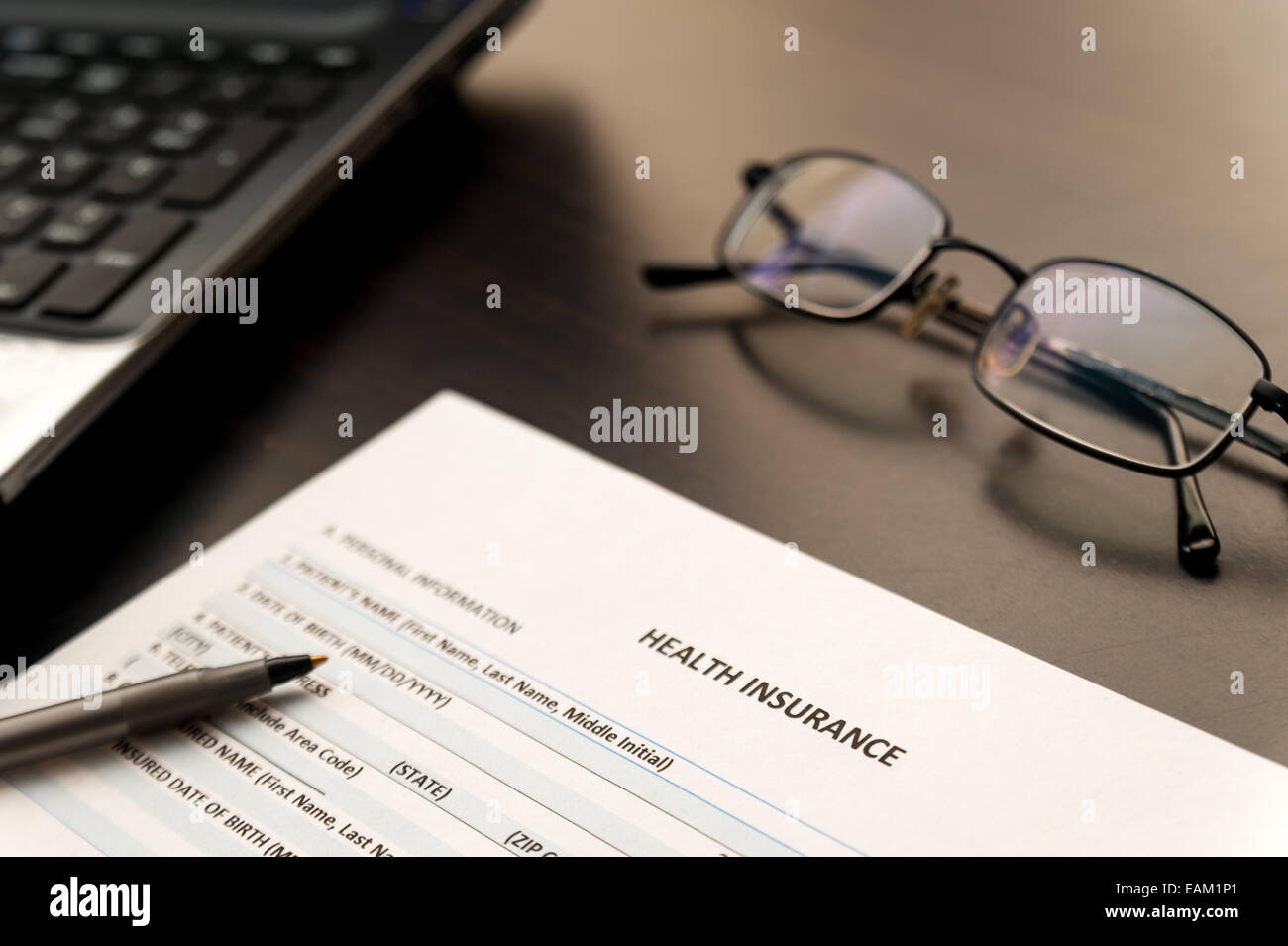 Filling health insurance application form Stock Photo - Alamy