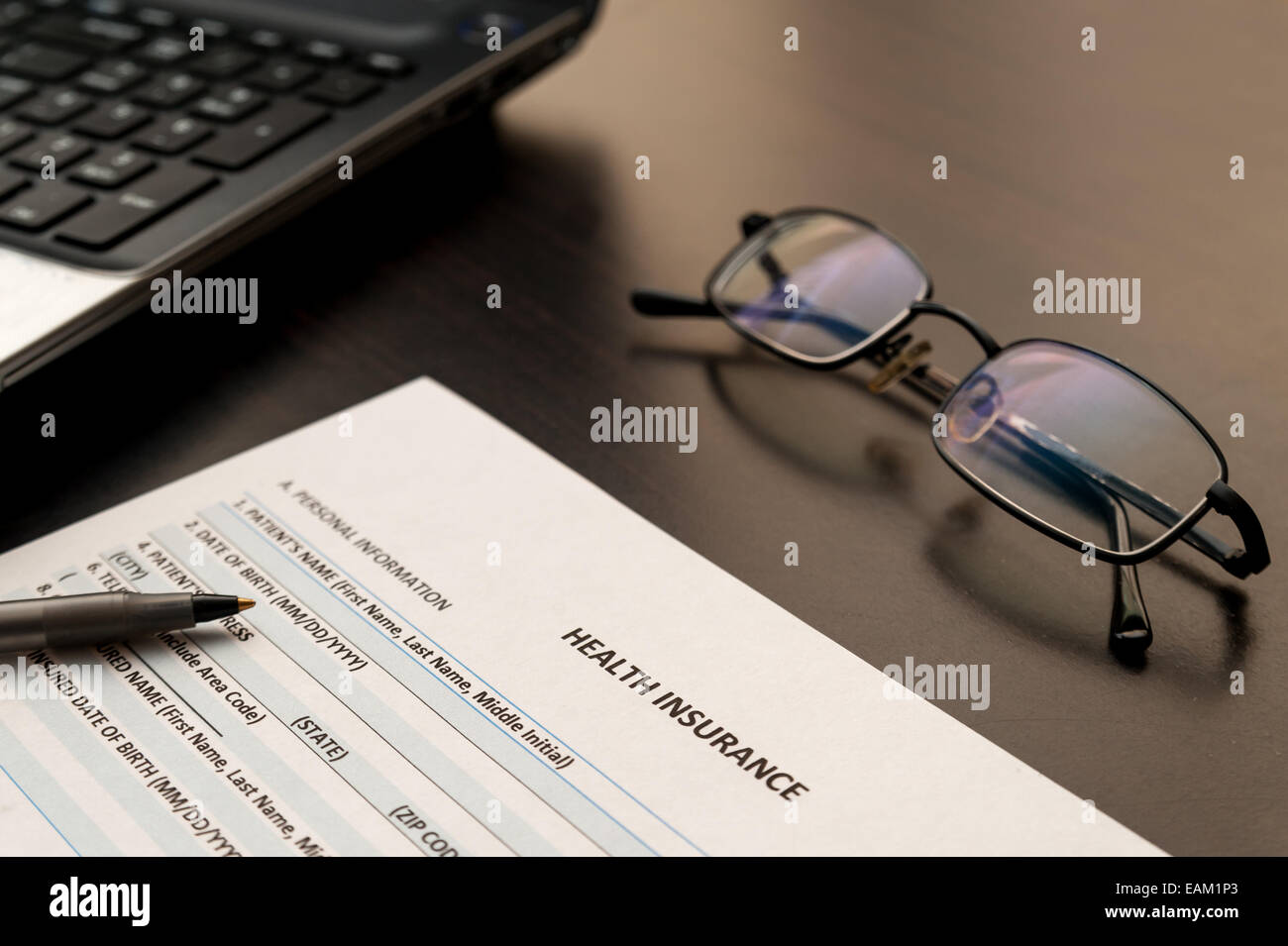 Filling health insurance application form Stock Photo - Alamy