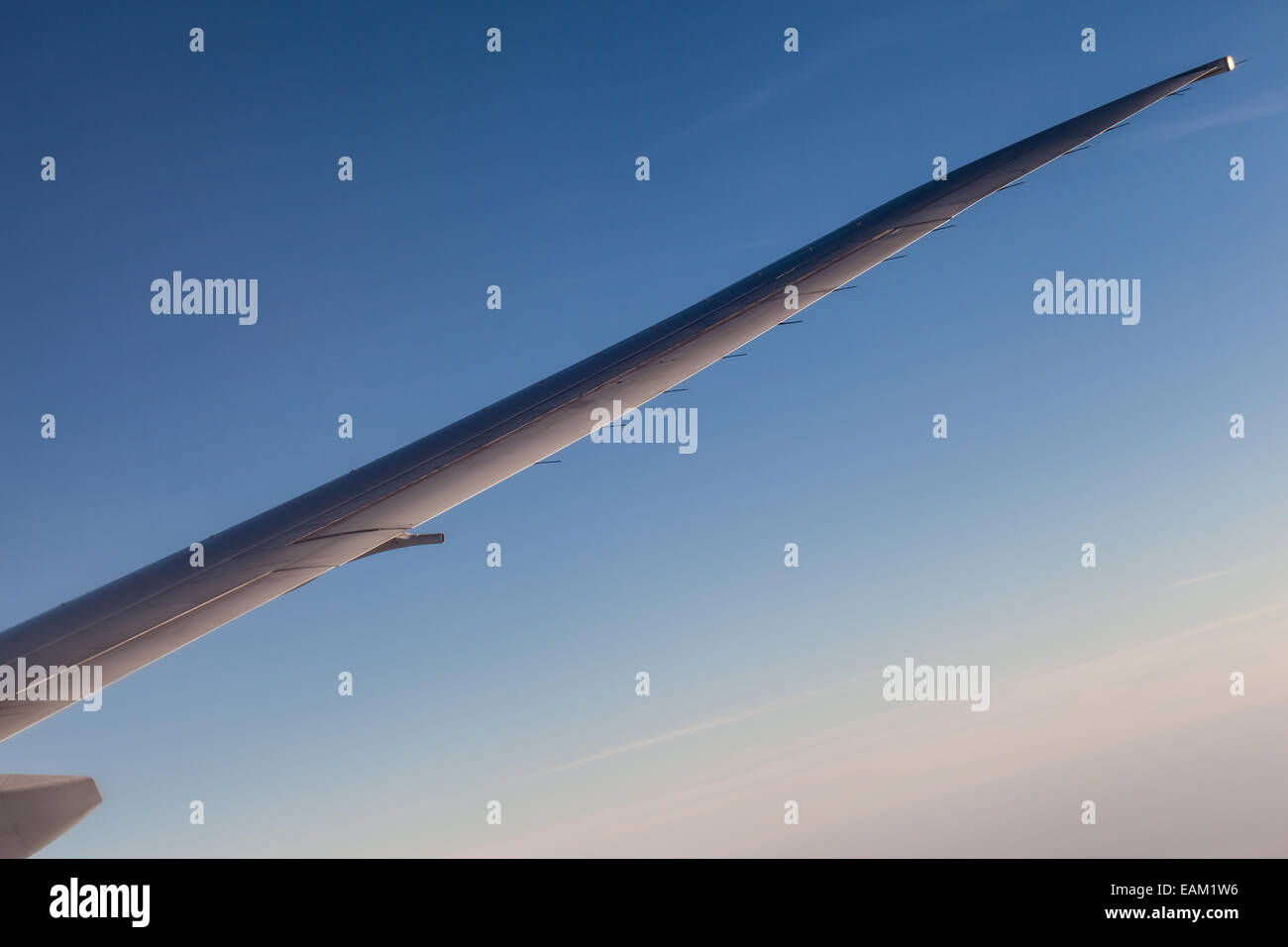 detail of the wing of a commercial airplane during flight Stock Photo ...