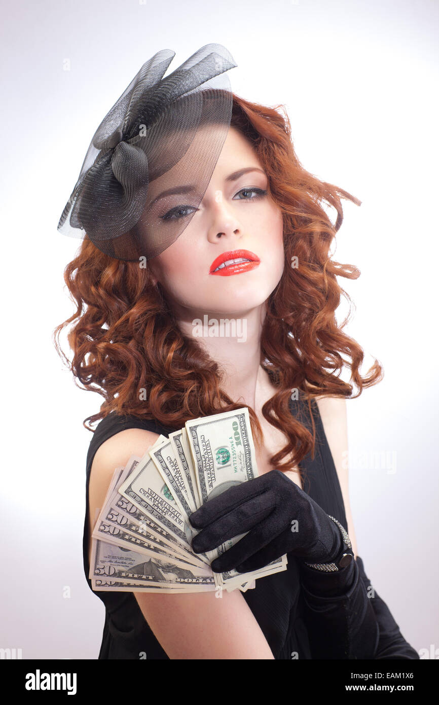 Young woman holding dollars money Stock Photo - Alamy Young woman holding dollars money Stock Photo - Alamy