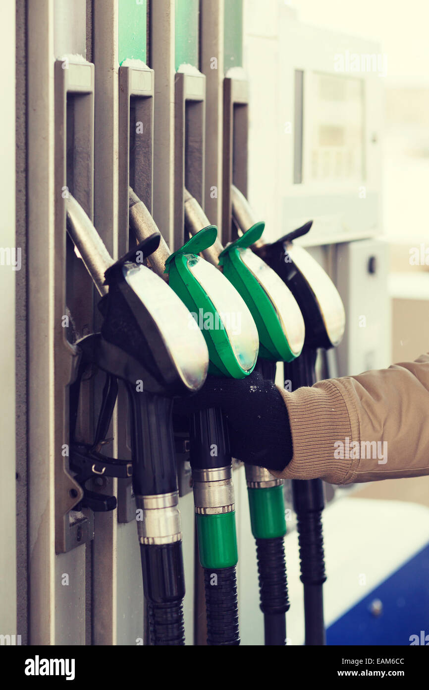 Hand holding gas fuel pump nozzle hi-res stock photography and images ...