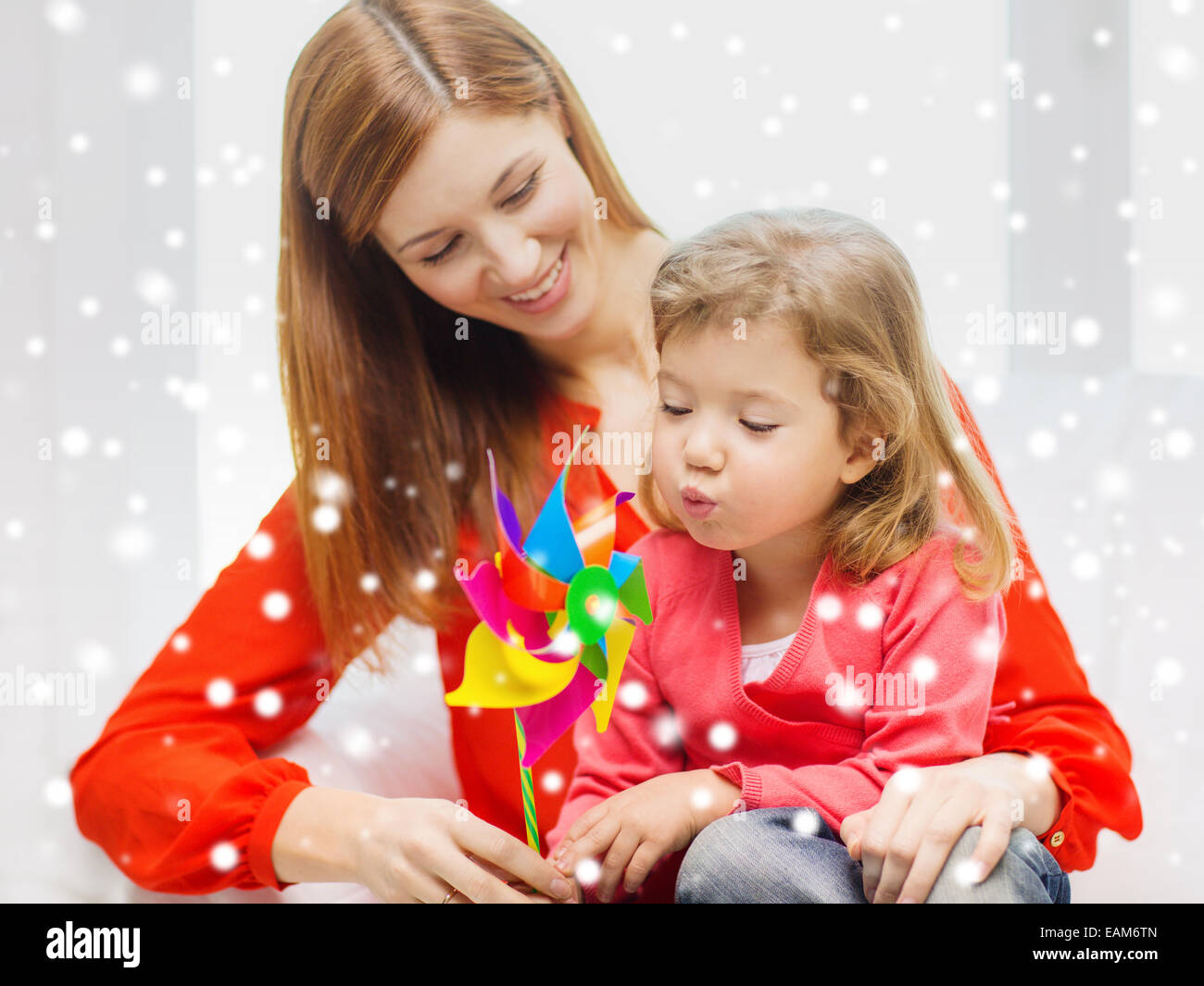 mother and daughter with pinwheel Stock Photo - Alamy