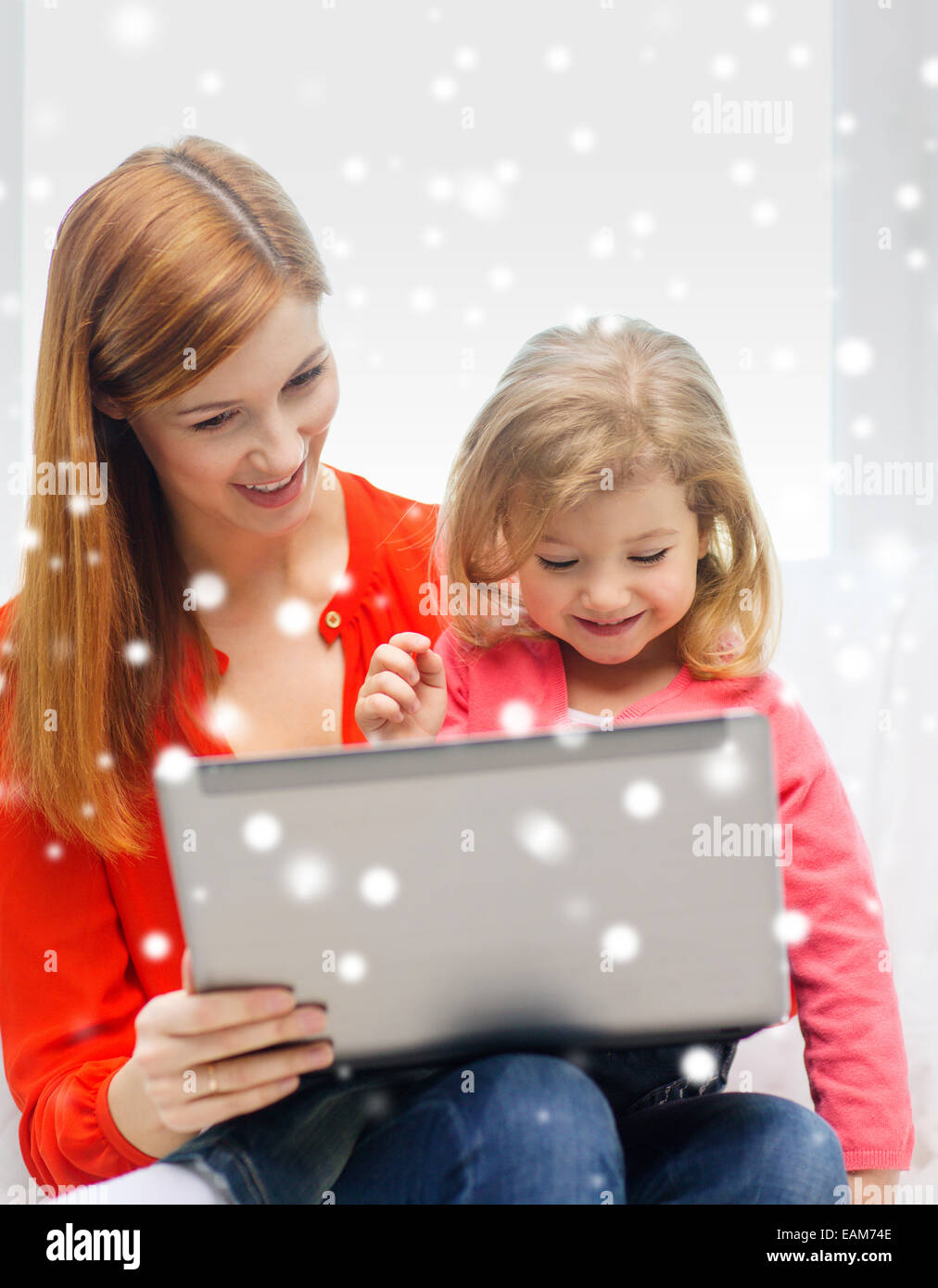 happy mother and daughter with laptop computer Stock Photo - Alamy