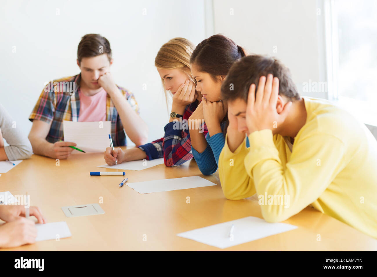 group of students with papers Stock Photo - Alamy
