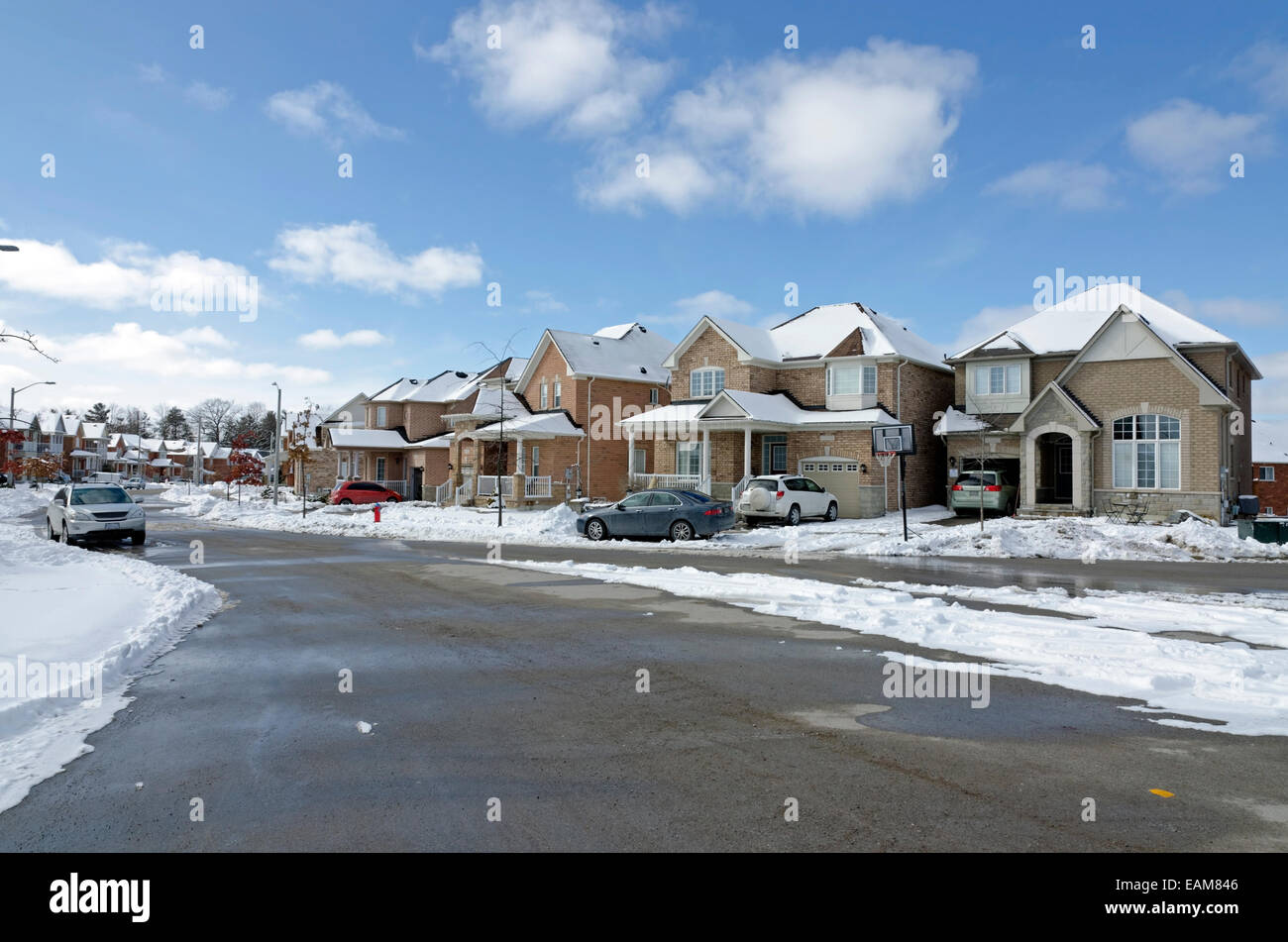The Canadian small town road after snow fall Stock Photo - Alamy