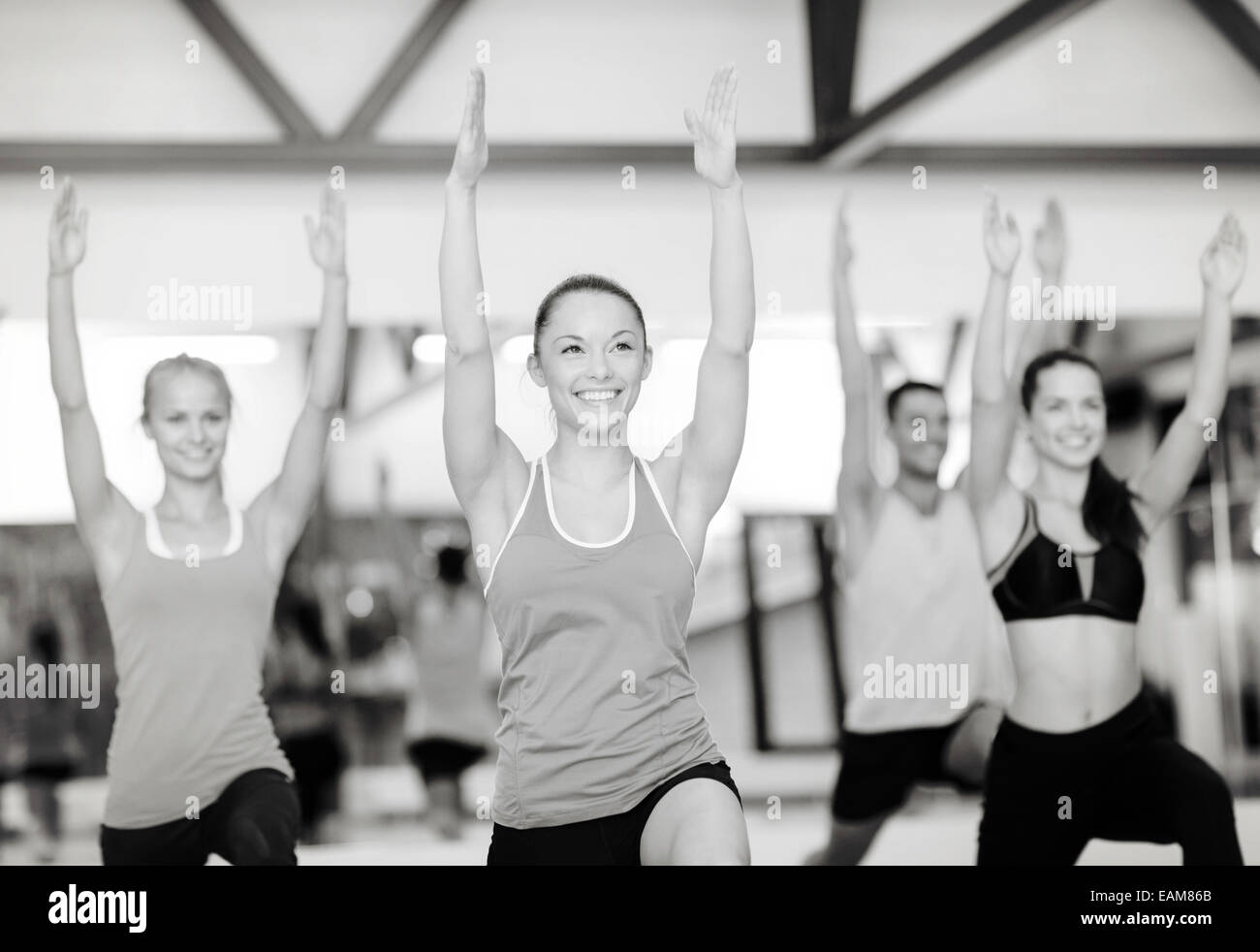 group of smiling people exercising in the gym Stock Photo - Alamy