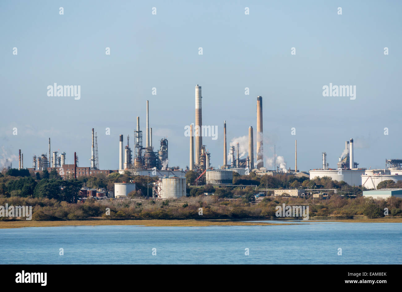 Exxon Mobil oil refinery with cooling towers, stacks and storage tanks ...