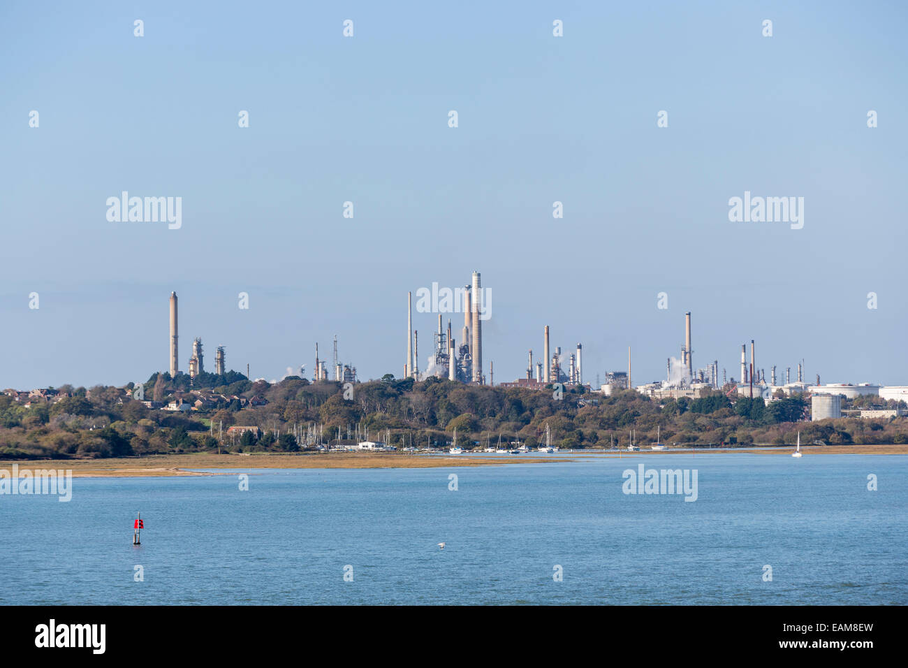 Exxon Mobil oil refinery with cooling towers, stacks and storage tanks ...