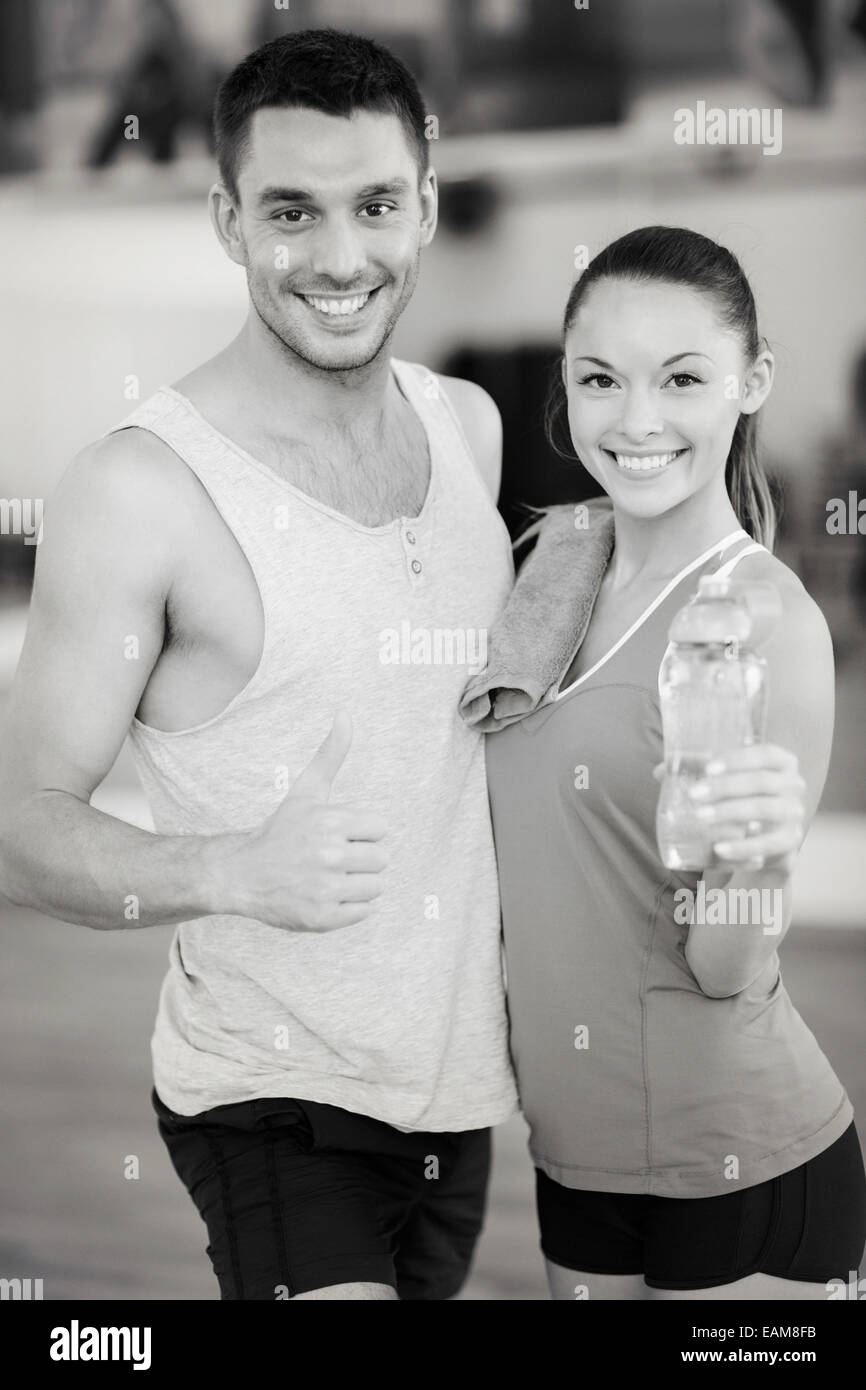 two smiling people in the gym Stock Photo - Alamy