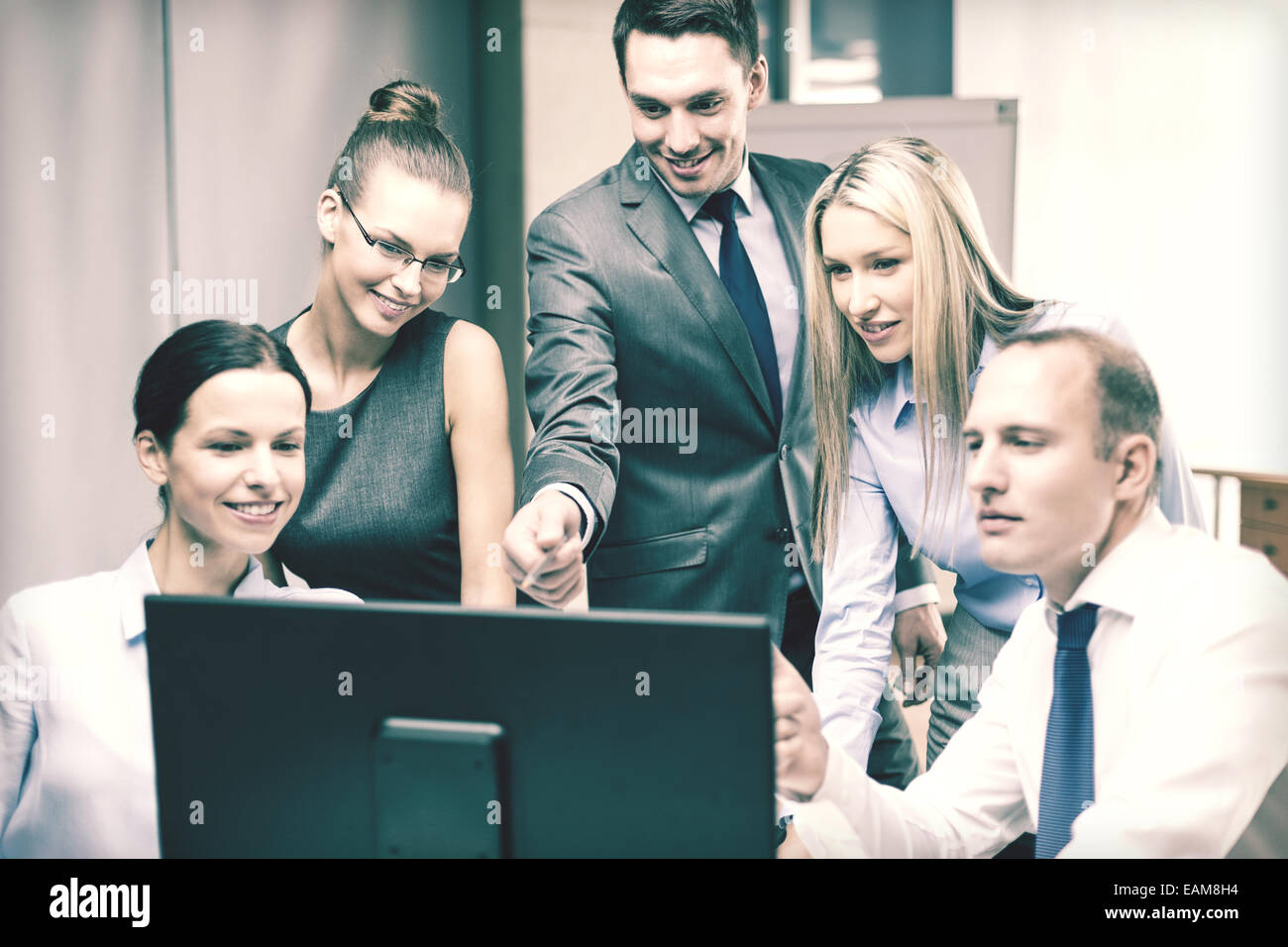 business team with monitor having discussion Stock Photo - Alamy