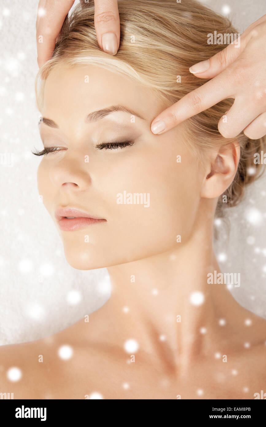 beautiful woman getting face or head massage Stock Photo - Alamy