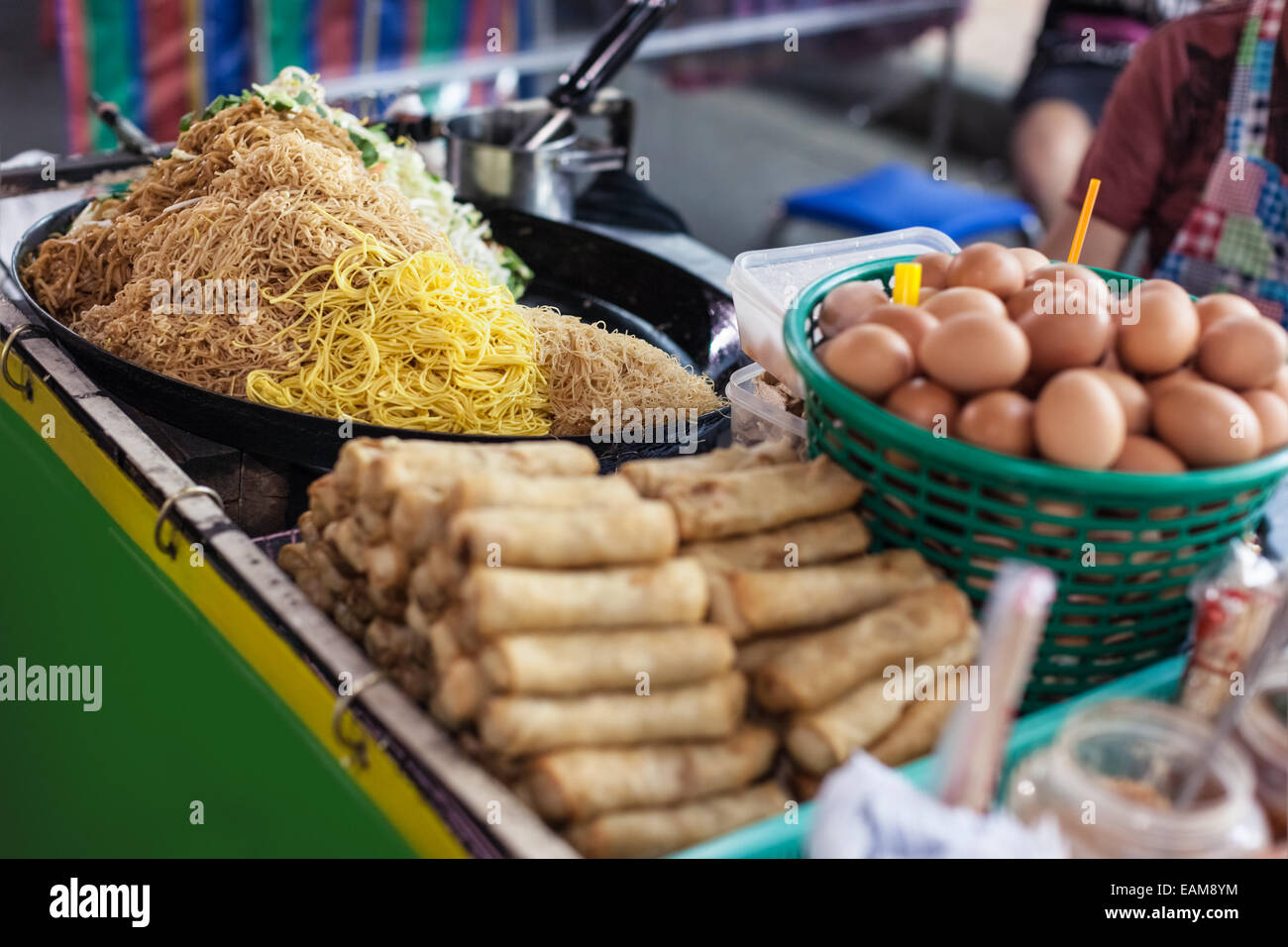 thai food stall in a street market in bangkok with noodles, spring ...