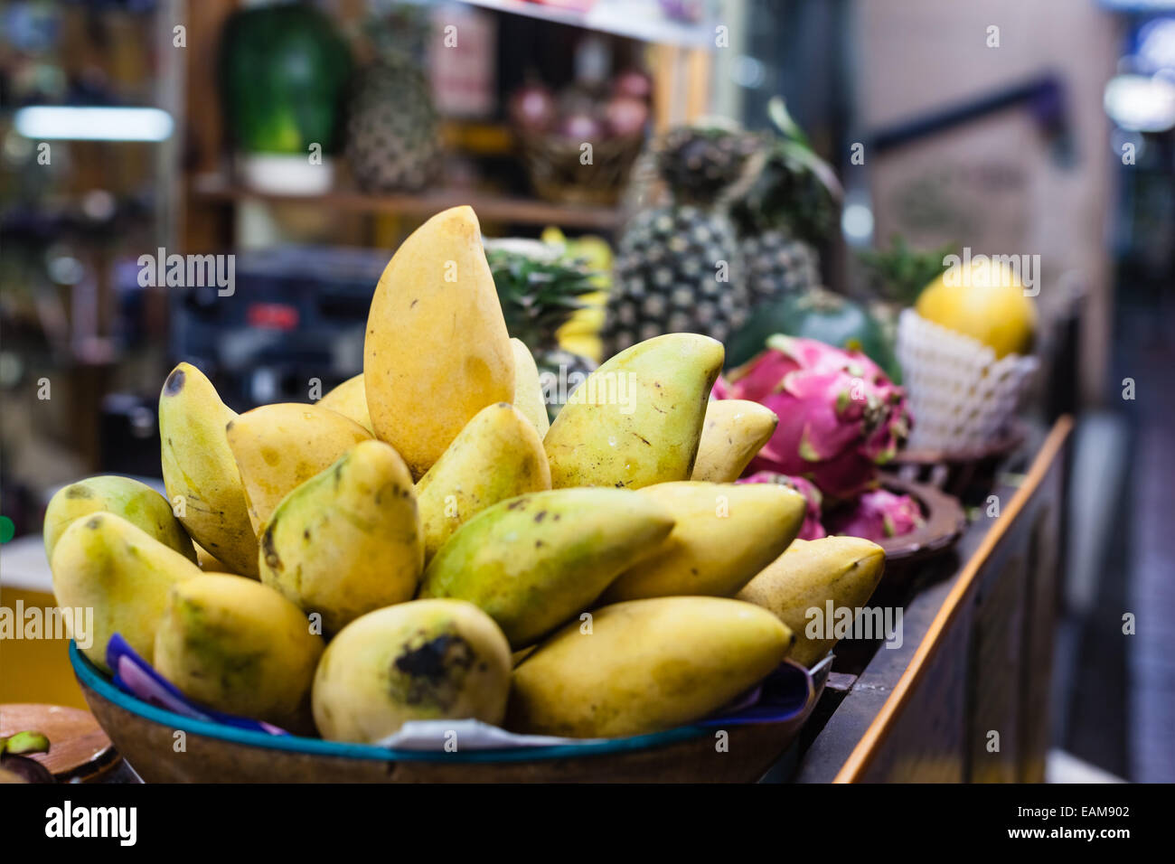 a basket full of mango fruits in a thai market stall Stock Photo - Alamy