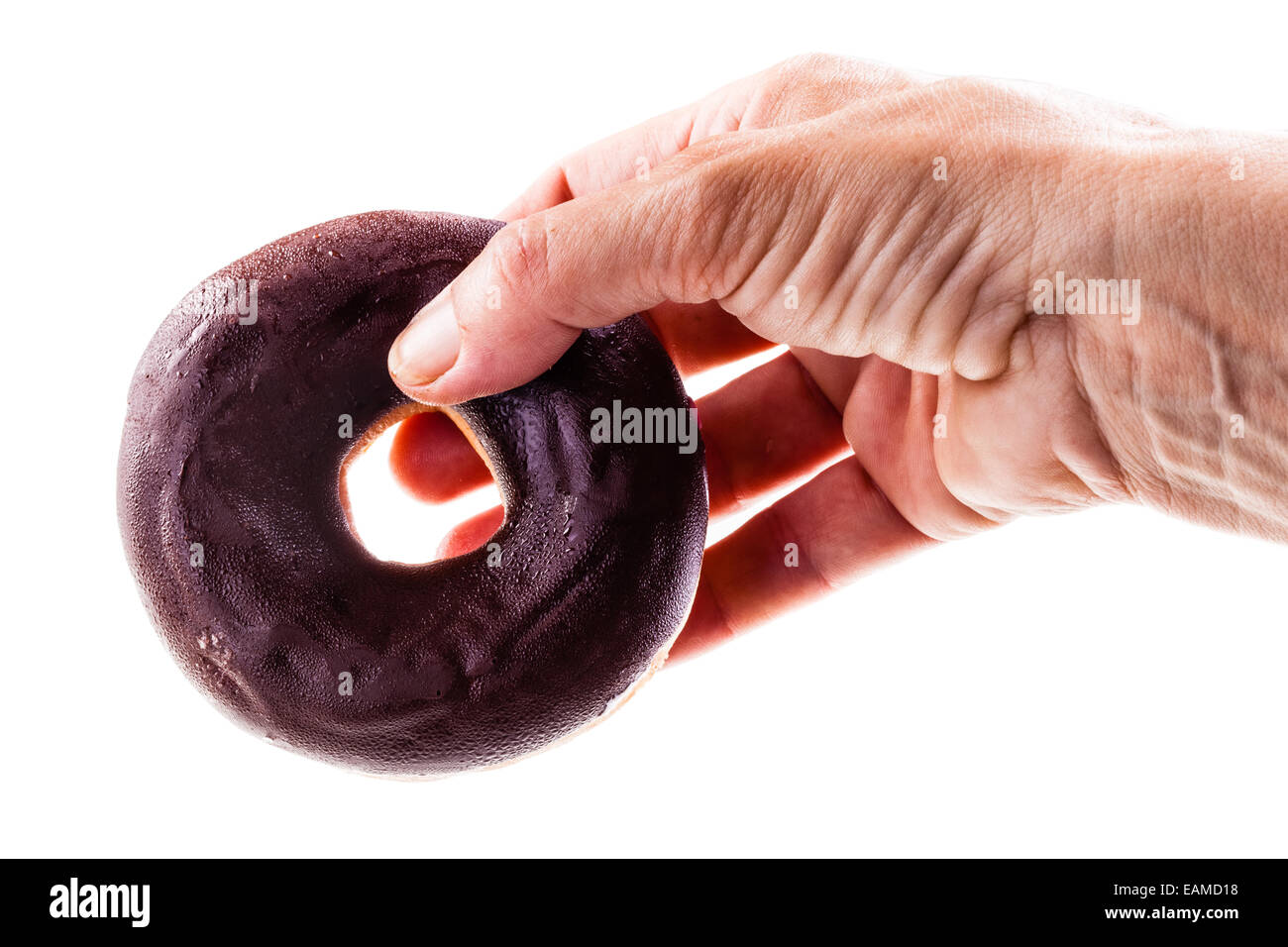 a hand holding a delicious donut isolated over a white background Stock ...