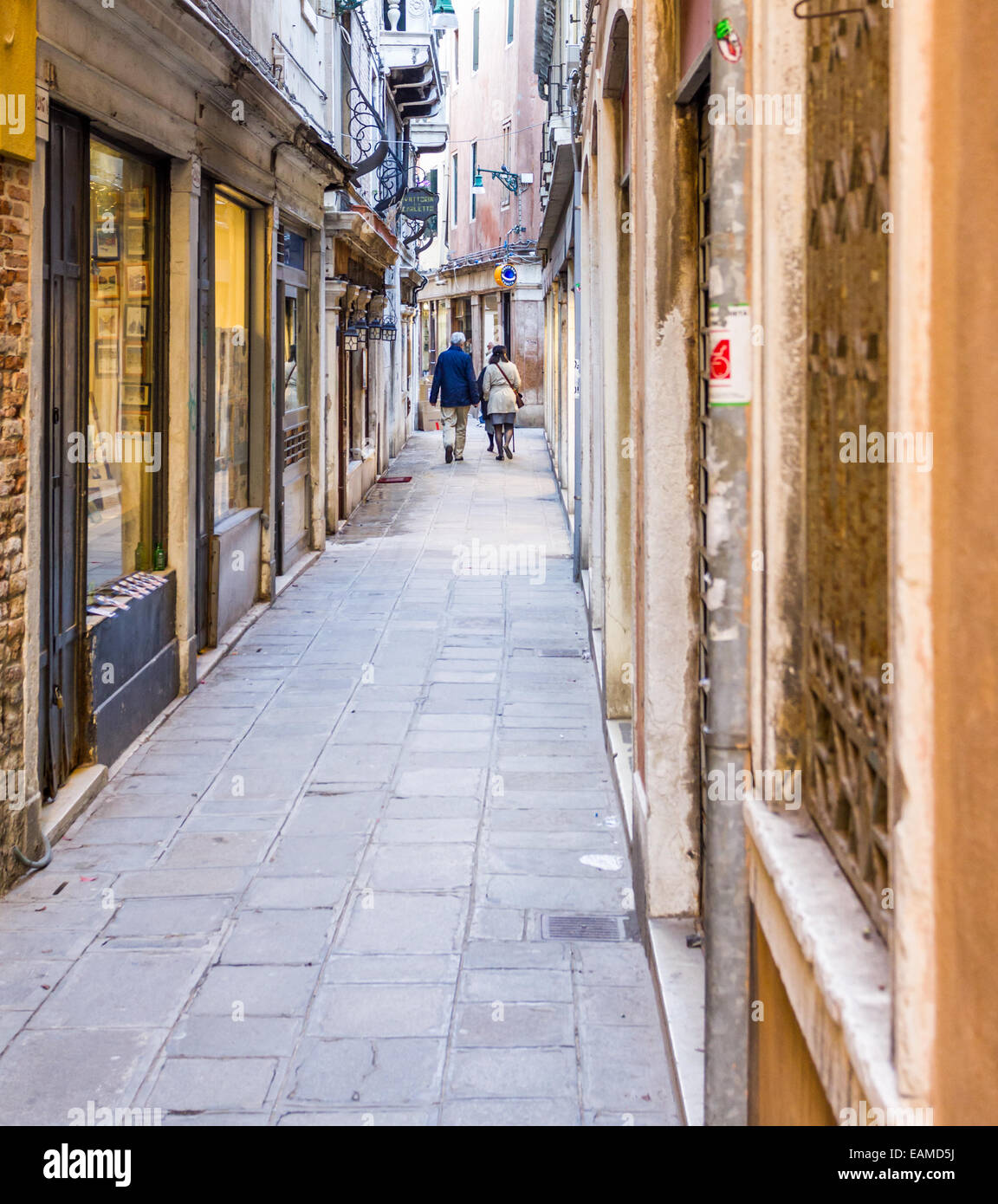 People walking down narrow lane in Venice, Italy Stock Photo - Alamy